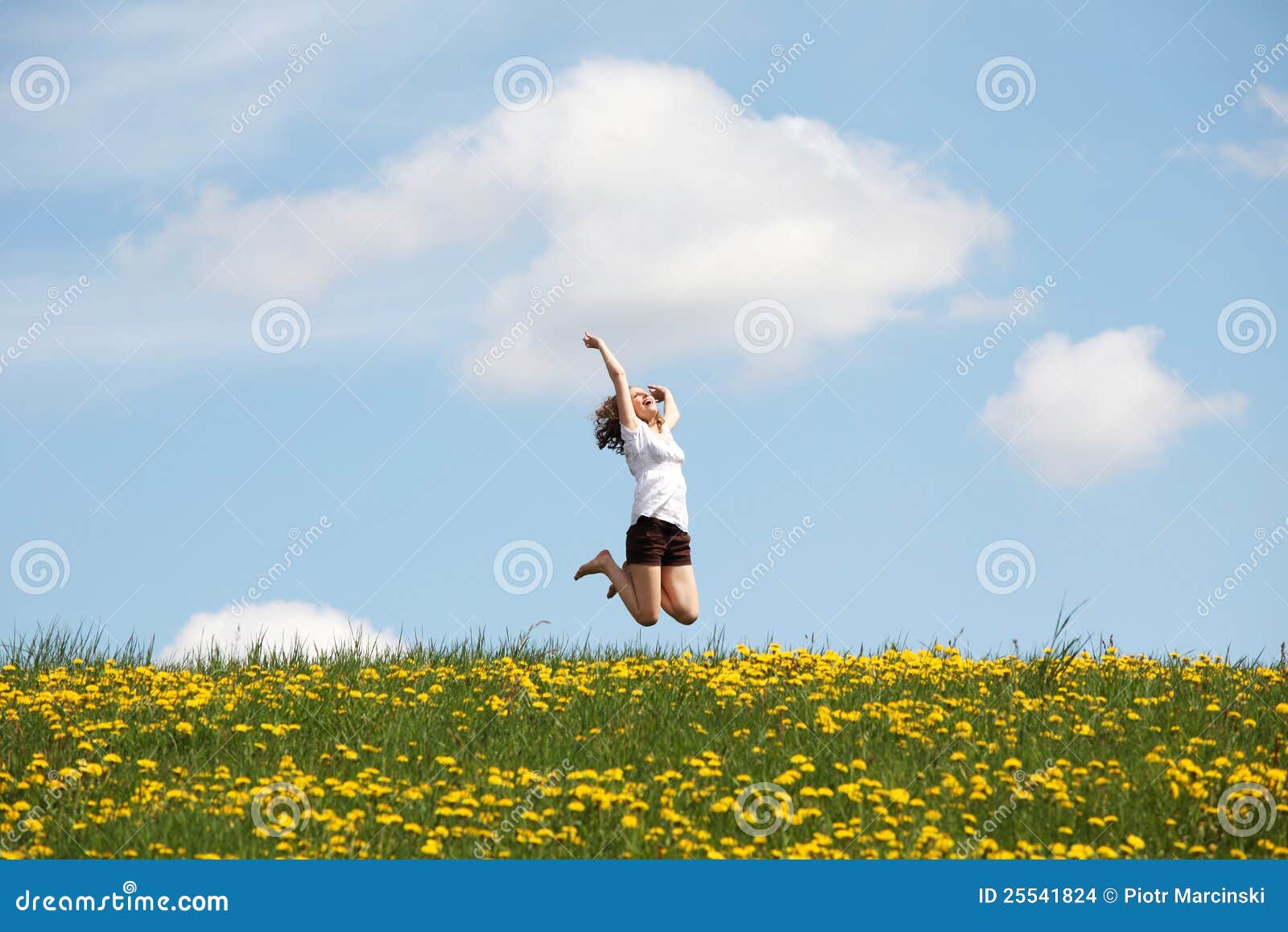 Woman Jumping on Blossom Meadow. Stock Photo - Image of girl, blue ...