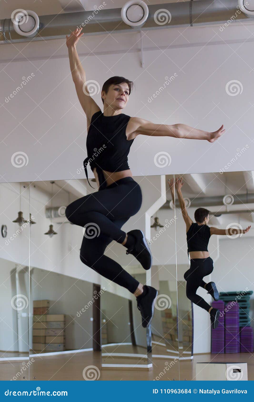 Woman jumping in the gym, stock photo. Image of dynamic - 110963684