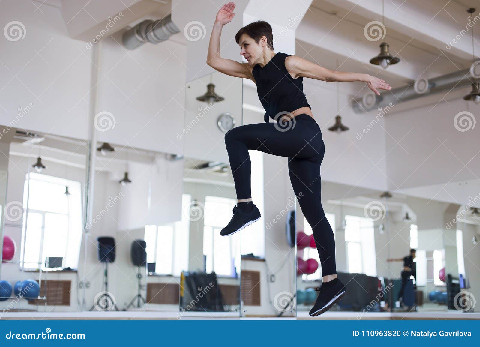 Woman jumping in the gym, stock photo. Image of cardio - 110963820