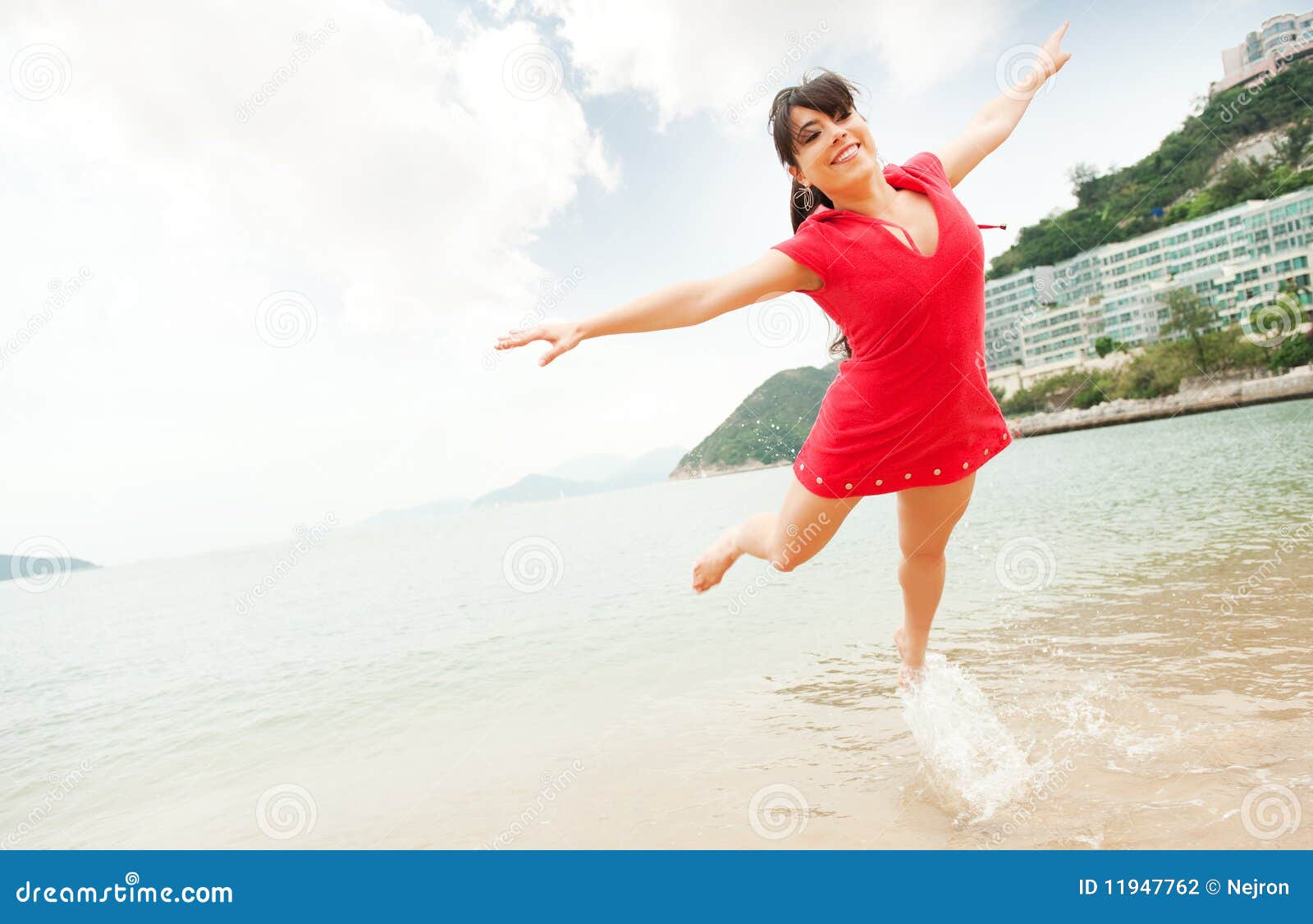 Woman jumping in the sea stock photo. Image of ocean - 11947762