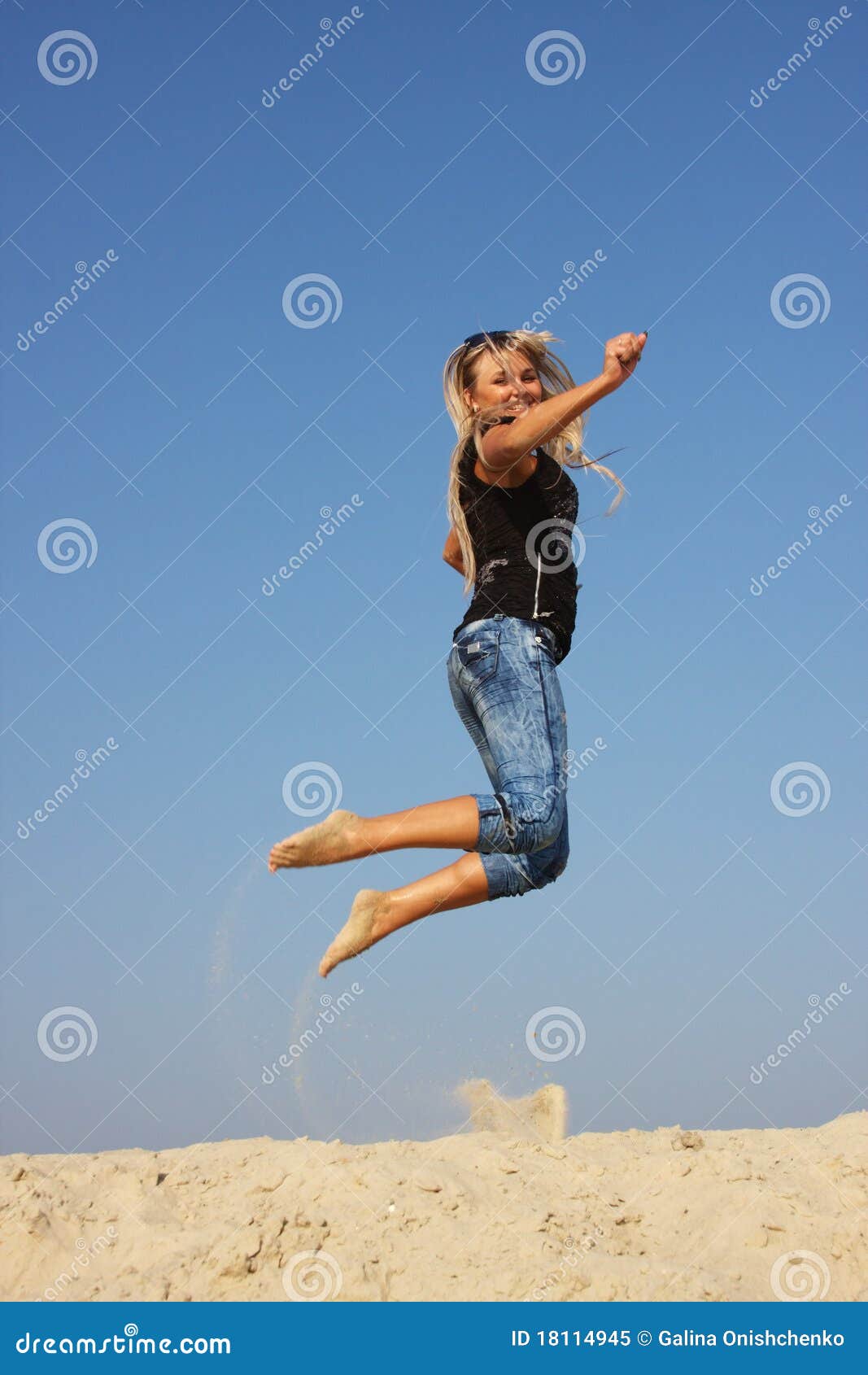 Woman jumps on a sand-pit stock image. Image of details - 18114945