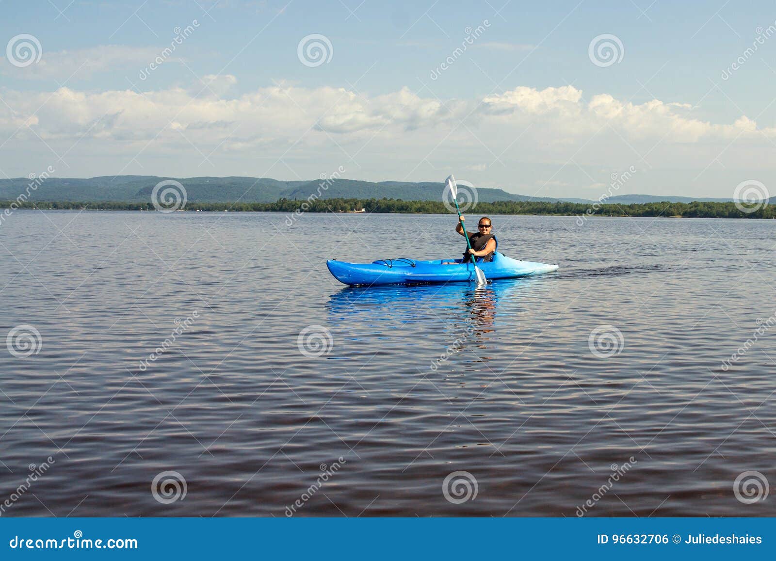 Woman Kayaking on a Calm Lake Stock Photo - Image of caucasian, paddle ...