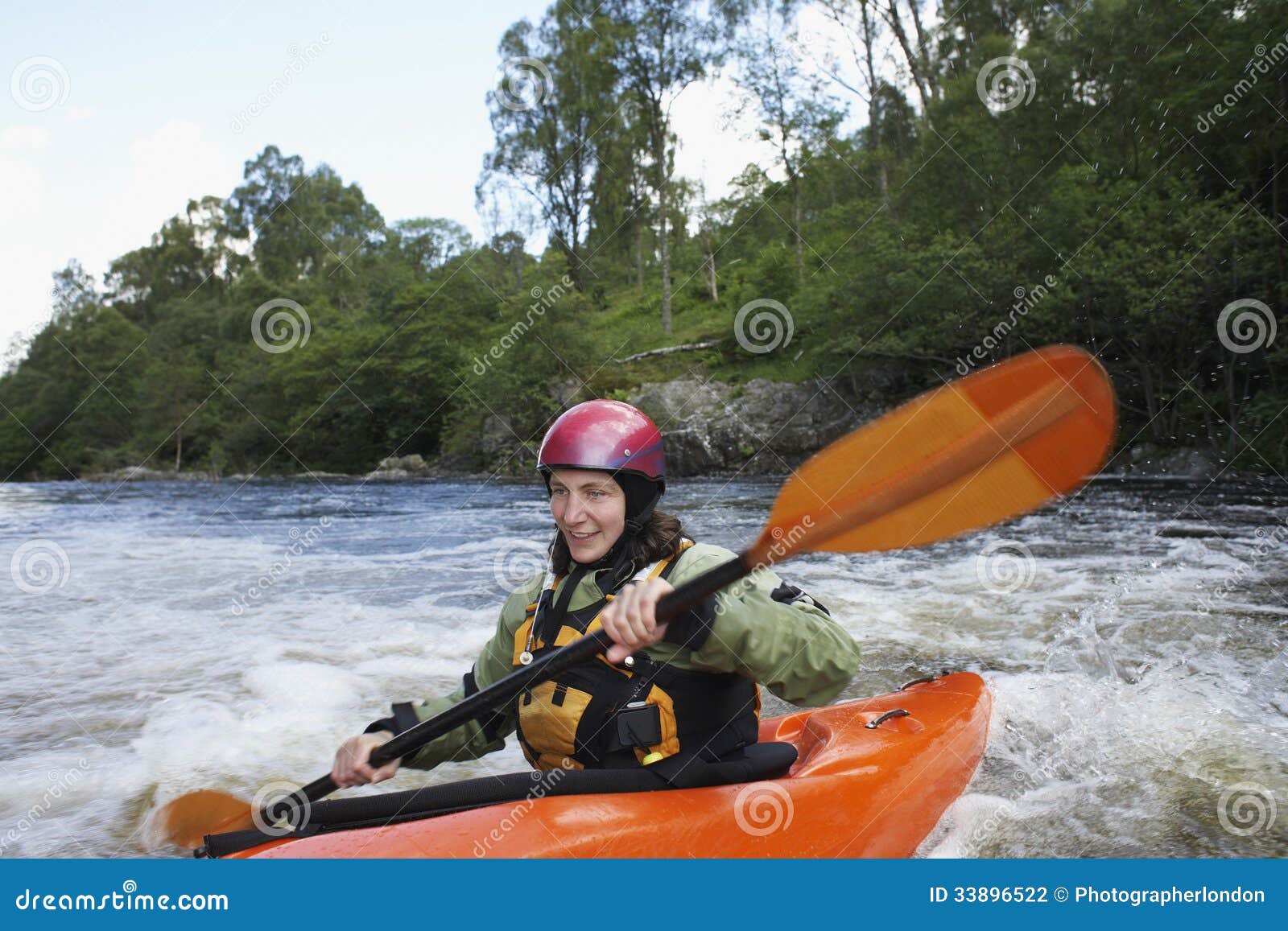 Woman kayaking in river stock photo. Image of agility - 33896522