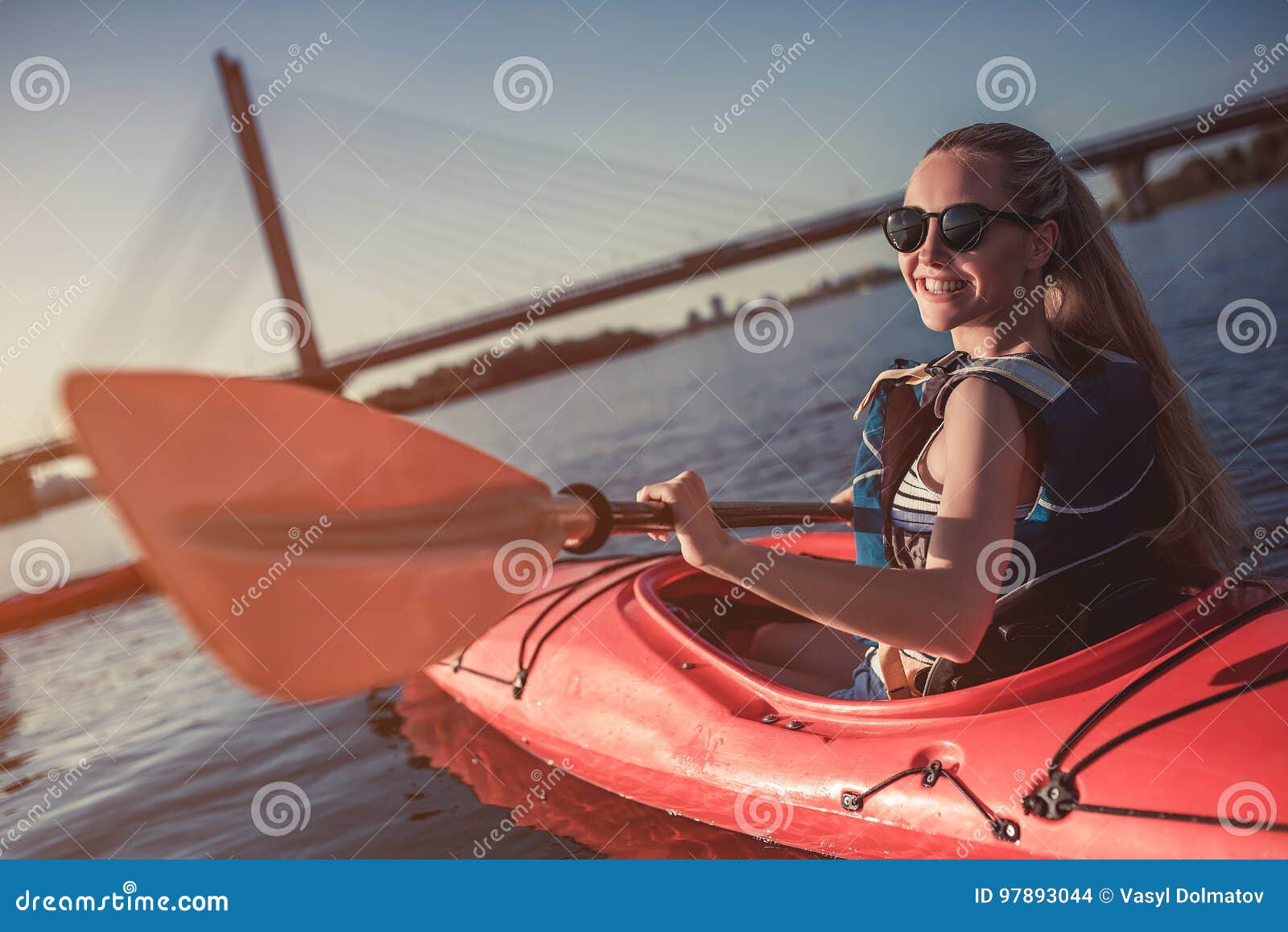 Woman kayaking on sunset stock photo. Image of alone - 97893044