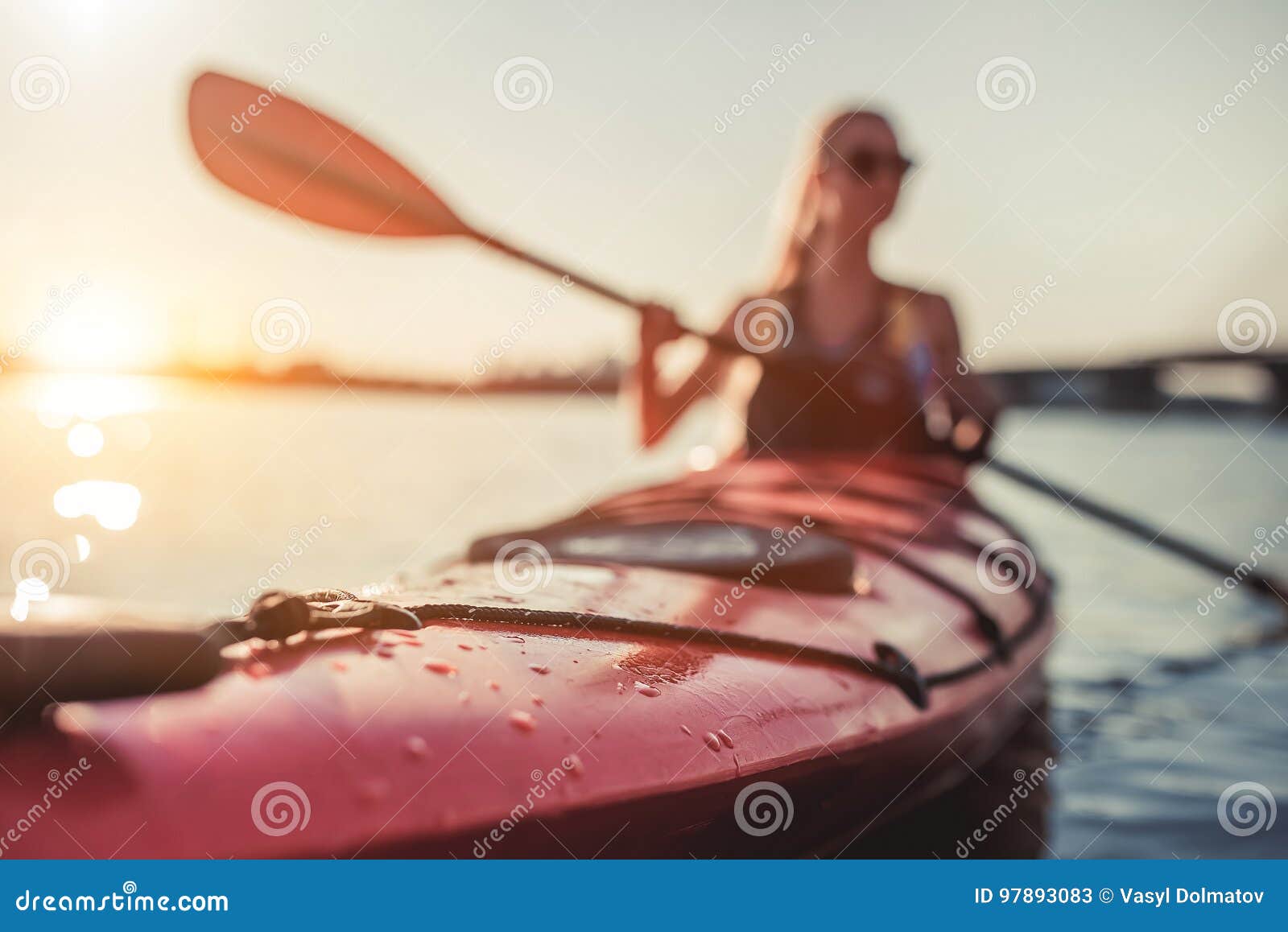 Woman kayaking on sunset stock image. Image of alone - 97893083