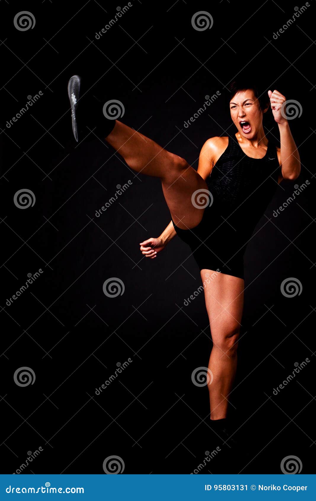 Woman Kick Boxing Isolated on Black. Stock Image - Image of vertical ...