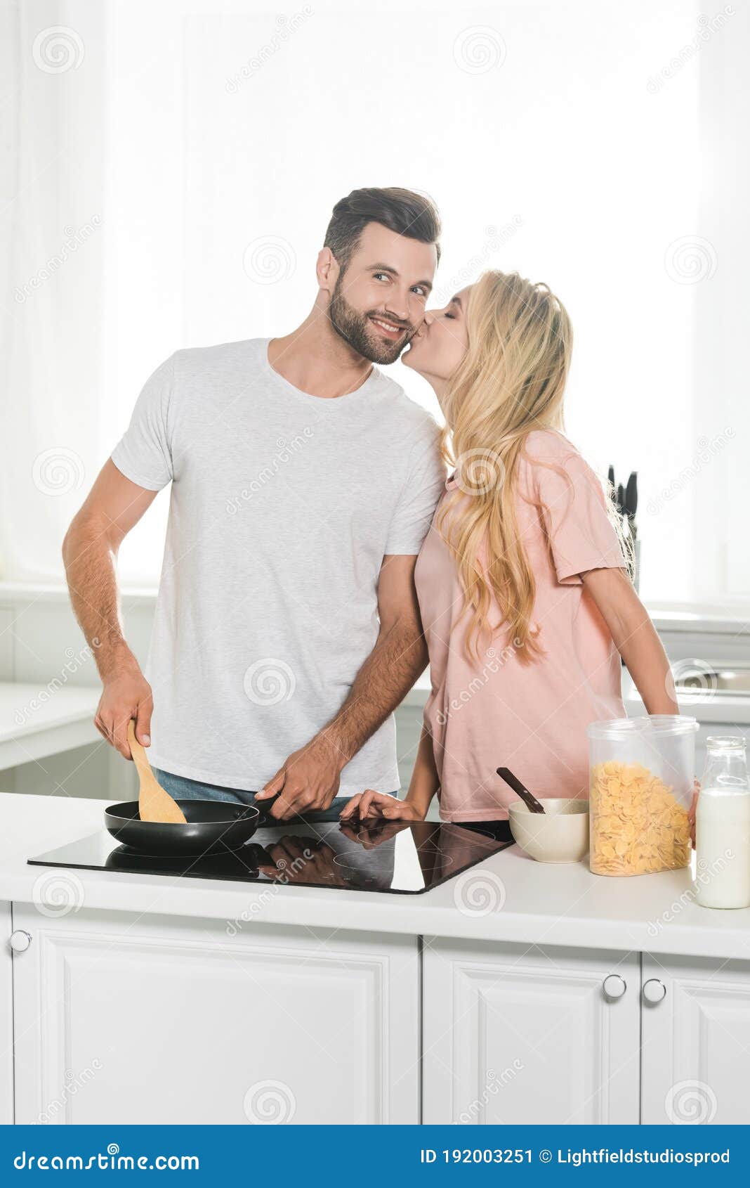 Woman Kissing Man Cooking Breakfast Stock Image - Image of beautiful ...