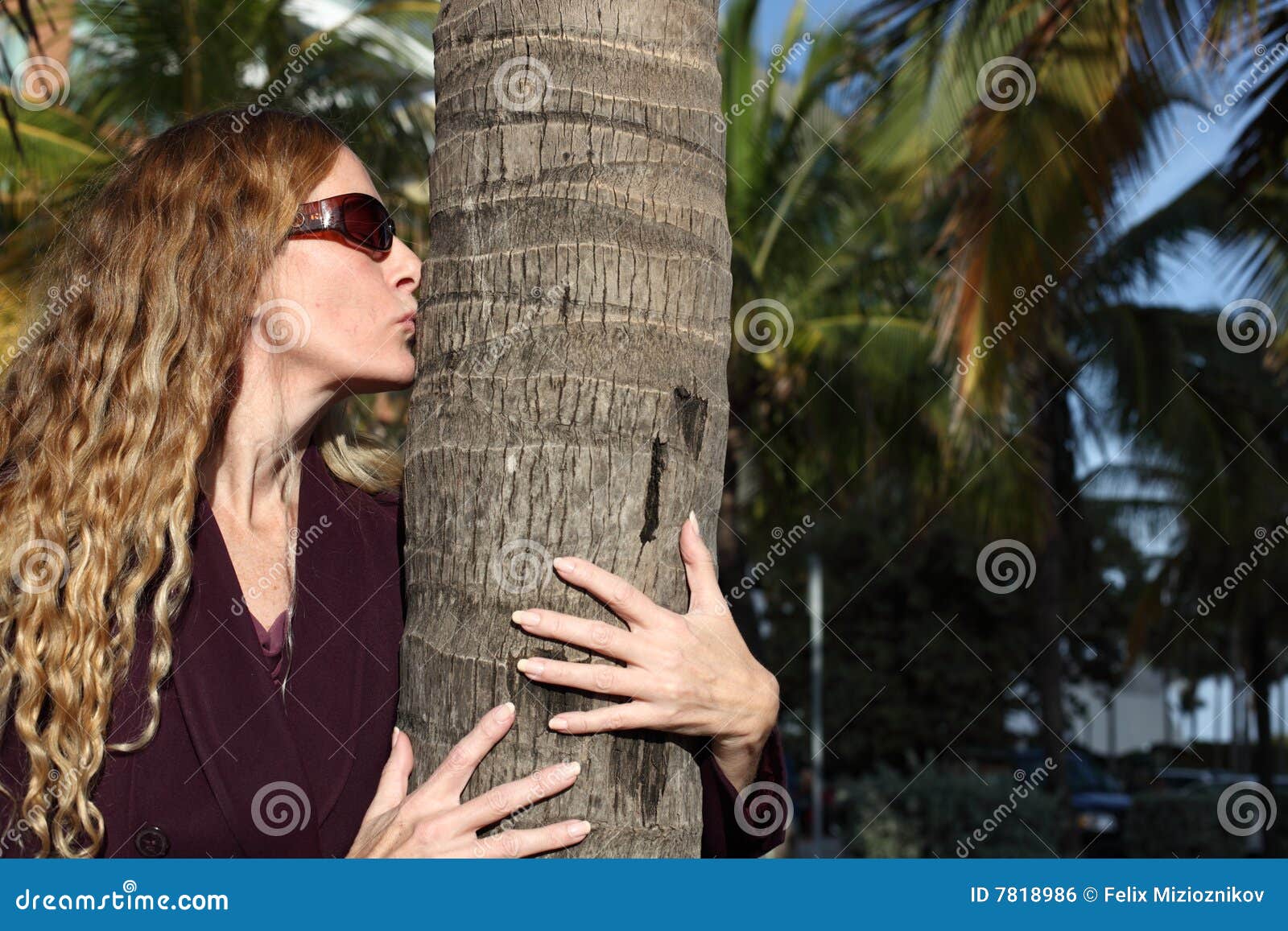 Woman kissing a tree stock photo. Image of environmentalist - 7818986