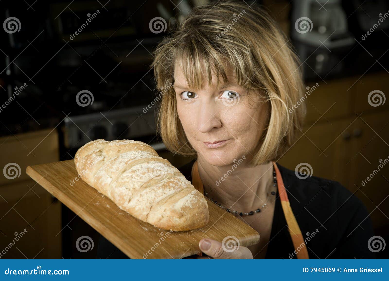 Woman in Kitchen with Bread Stock Image - Image of cooking, bake: 7945069