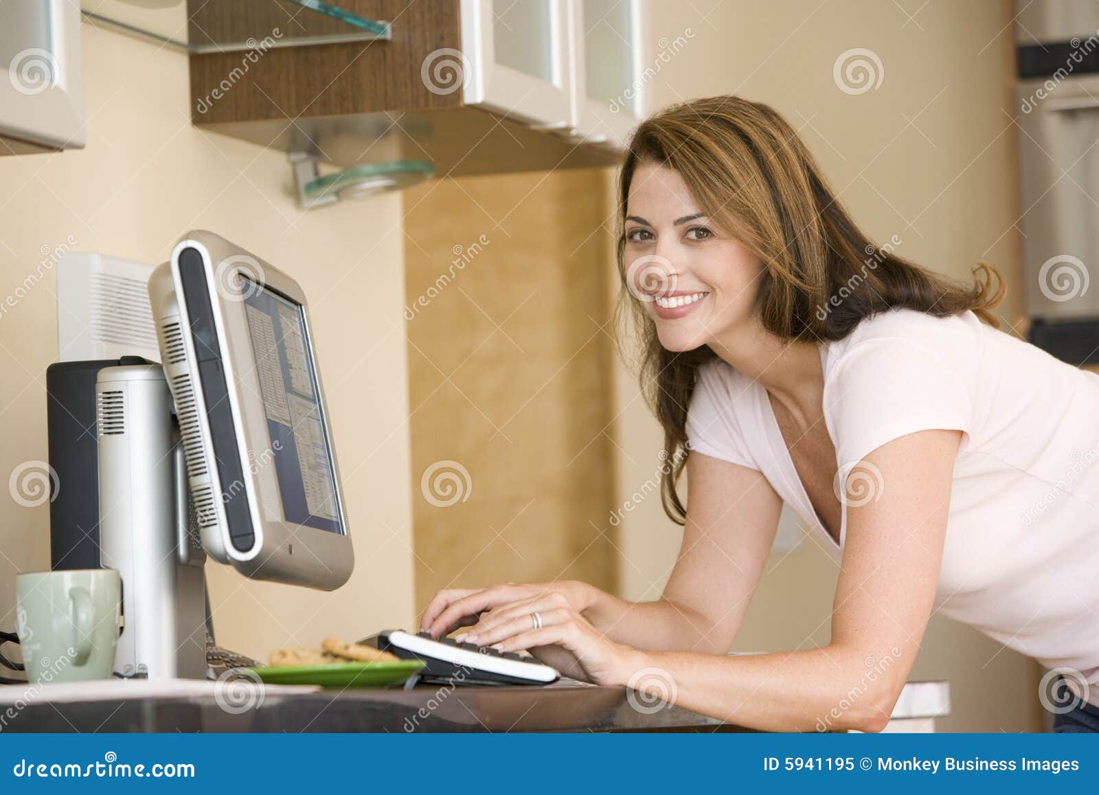 Woman in Kitchen with Computer Smiling Stock Image - Image of happy ...