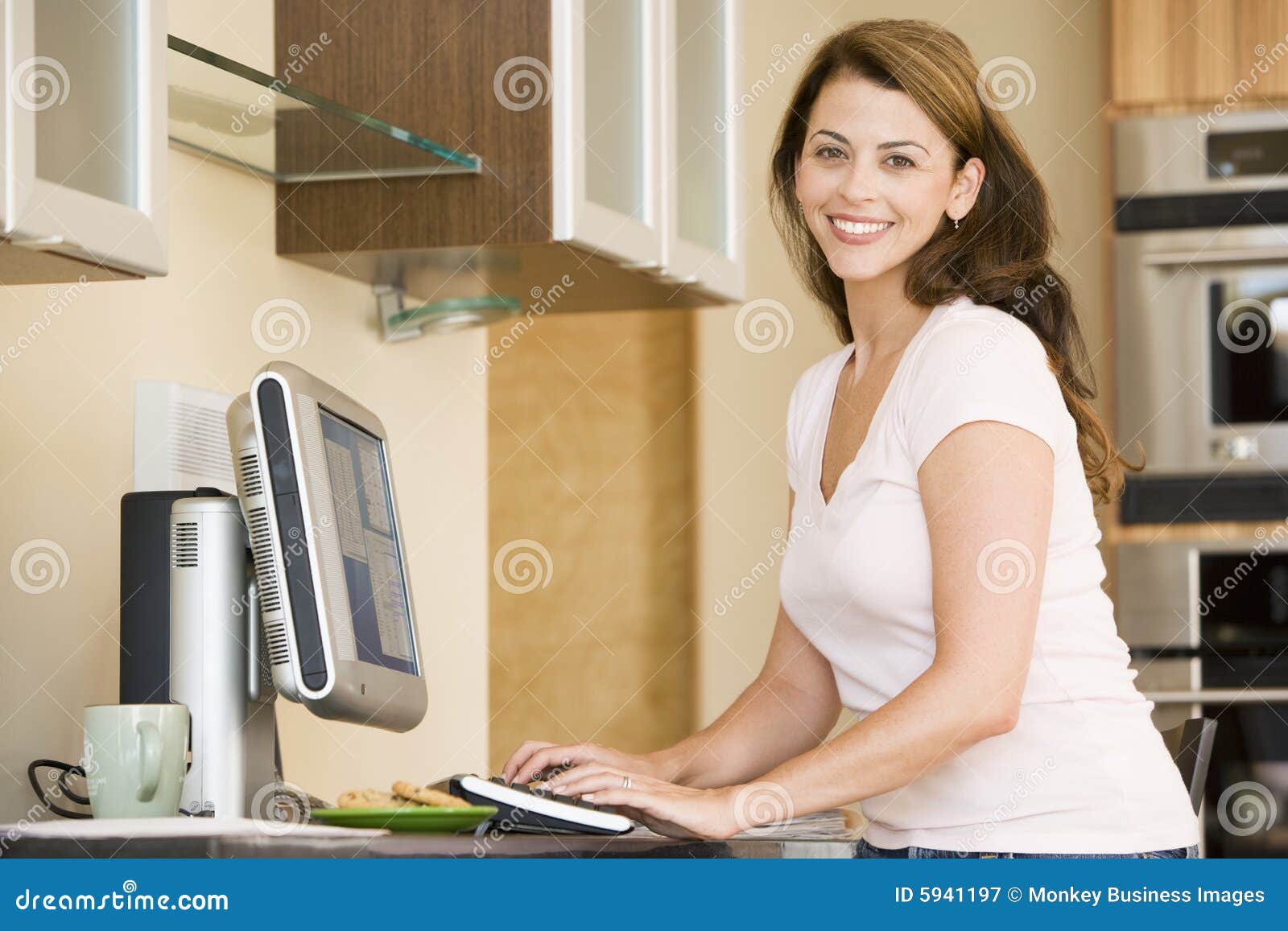 Woman in Kitchen with Computer Smiling Stock Image - Image of happy ...