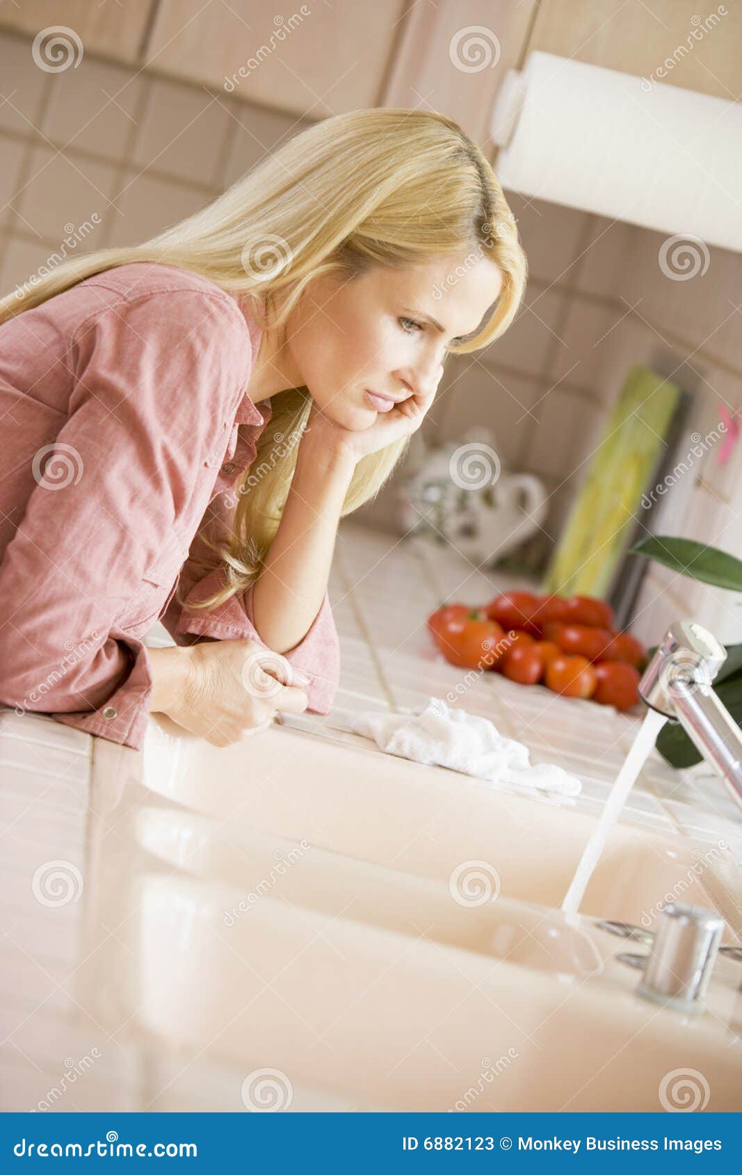 Woman at Kitchen Counter stock image. Image of kitchen - 6882123