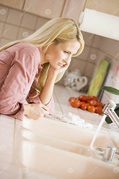 Woman at Kitchen Counter stock image. Image of kitchen - 6882123