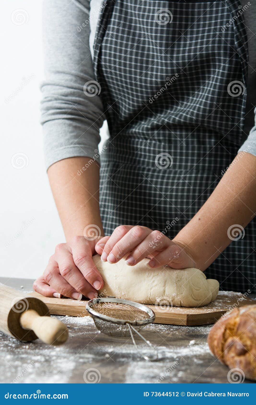 Woman kneading bread dough stock photo. Image of kitchen - 73644512