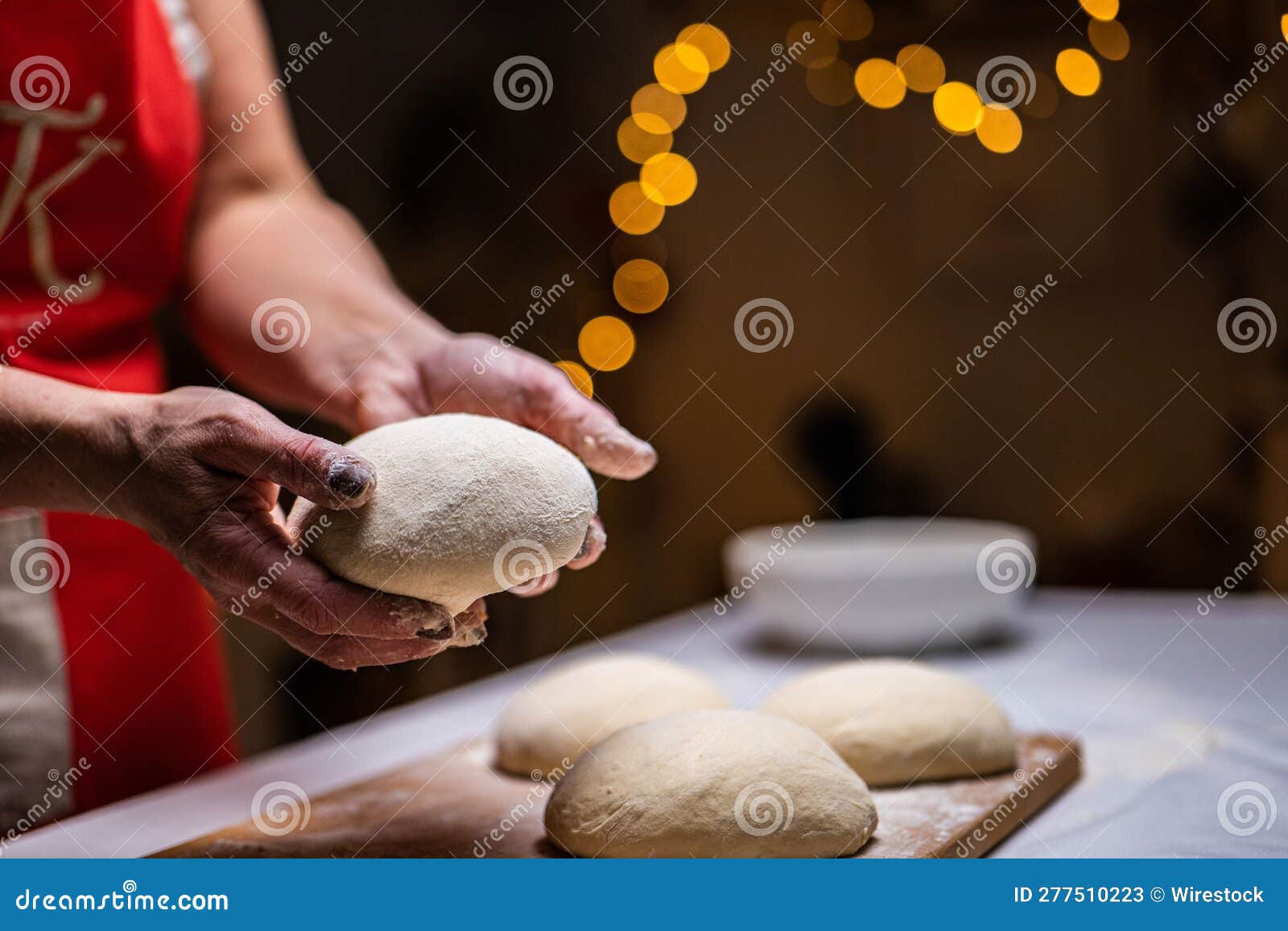 A Person is Making Bread in a Kitchen Using a Cutting Board Stock Image ...