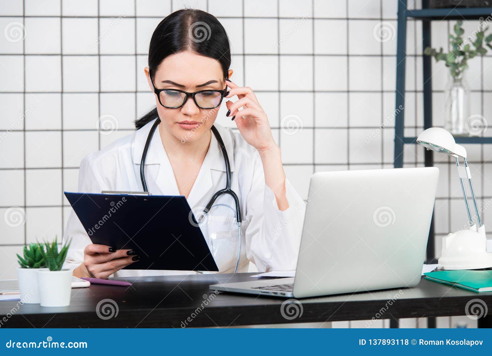 Woman Lab Assistant Working at Her Desk, Hospital, Documents Stock ...