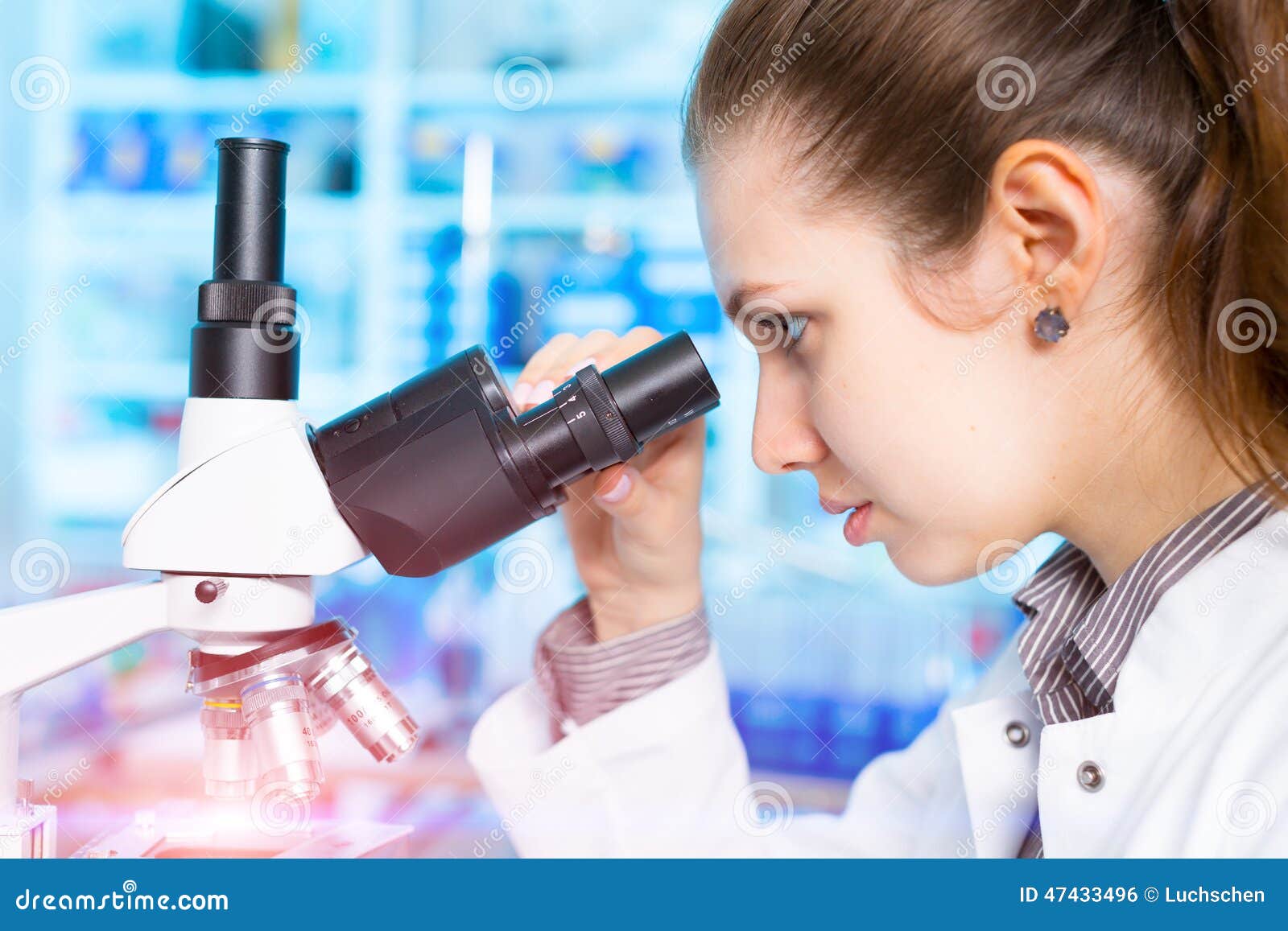 Woman Laboratory Assistant Uses Microscope Stock Photo - Image of ...