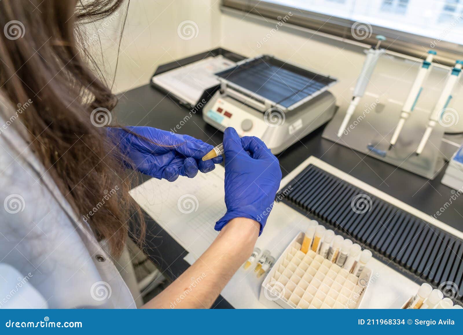 Woman in Laboratory Doing Tests for Vaccine Blood Extraction and ...