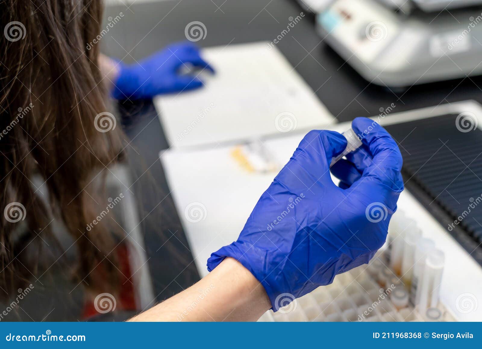 Woman in Laboratory Doing Tests for Vaccine Blood Extraction and ...