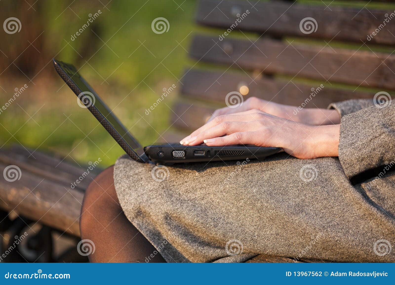 Woman with laptop on bench stock photo. Image of bench - 13967562