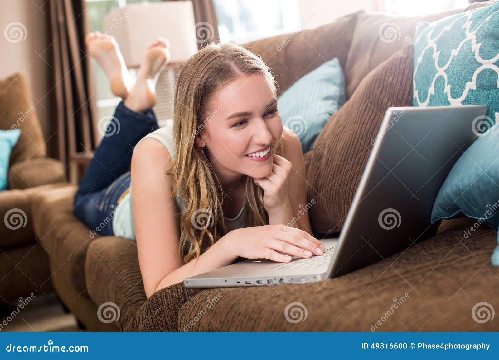 Woman laptop couch stock photo. Image of lifestyle, connectivity - 49316600