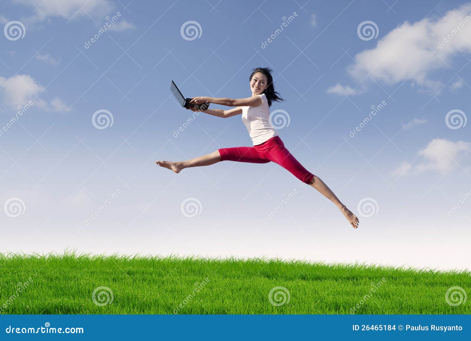Woman with Laptop Jumping in Meadow Stock Photo - Image of jump ...