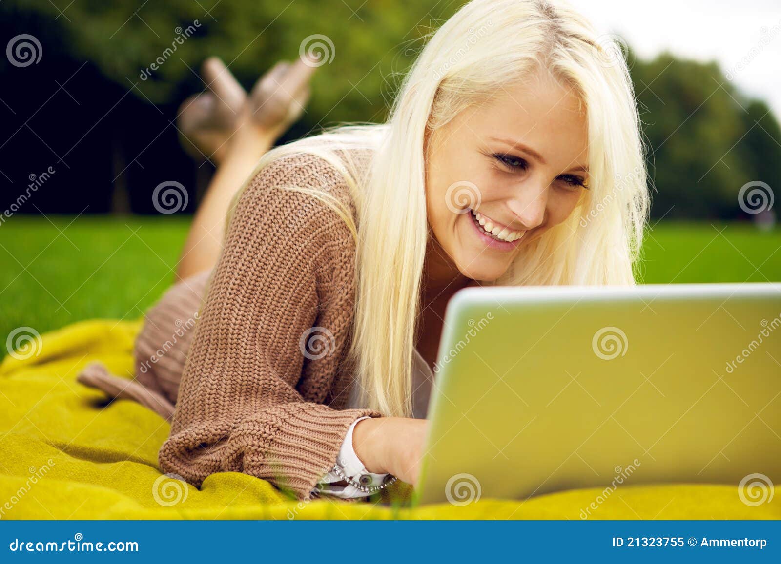 Woman with laptop laughing stock image. Image of green - 21323755