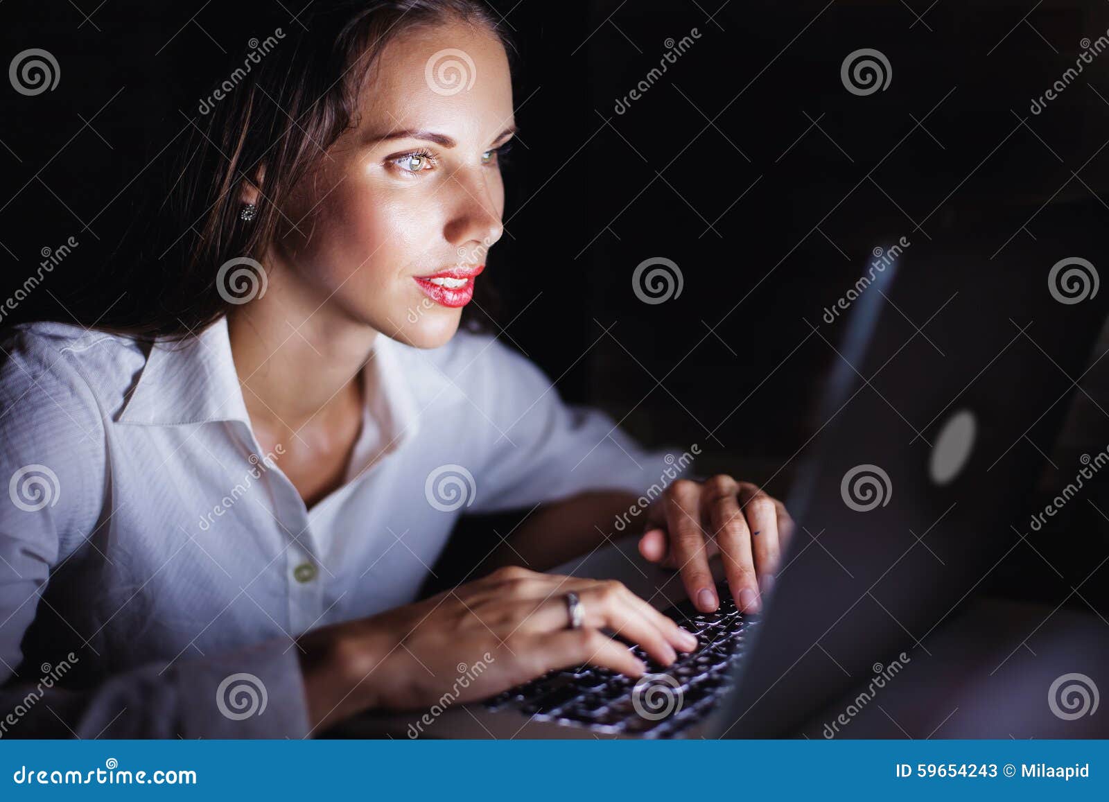 Woman with laptop at night stock image. Image of browsing - 59654243