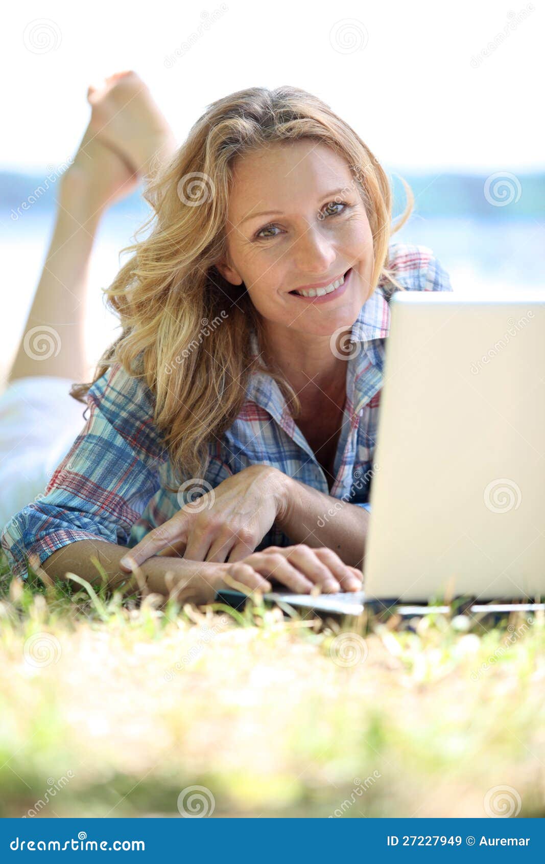 Woman on laptop outside stock image. Image of caucasian - 27227949