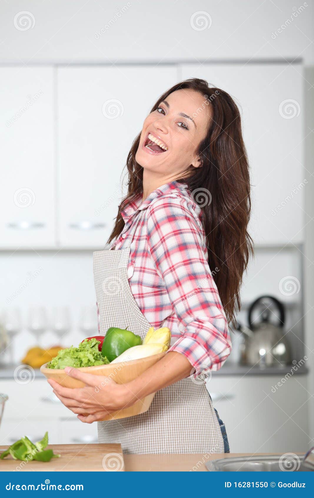 Woman laughing in kitchen stock photo. Image of expression - 16281550