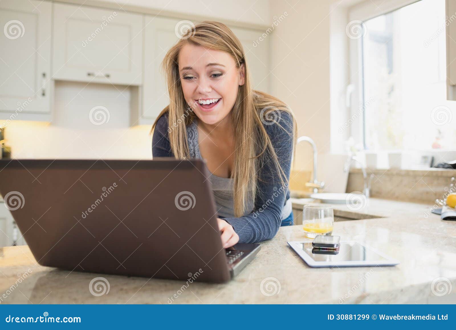 Woman laughing at laptop stock image. Image of smart - 30881299