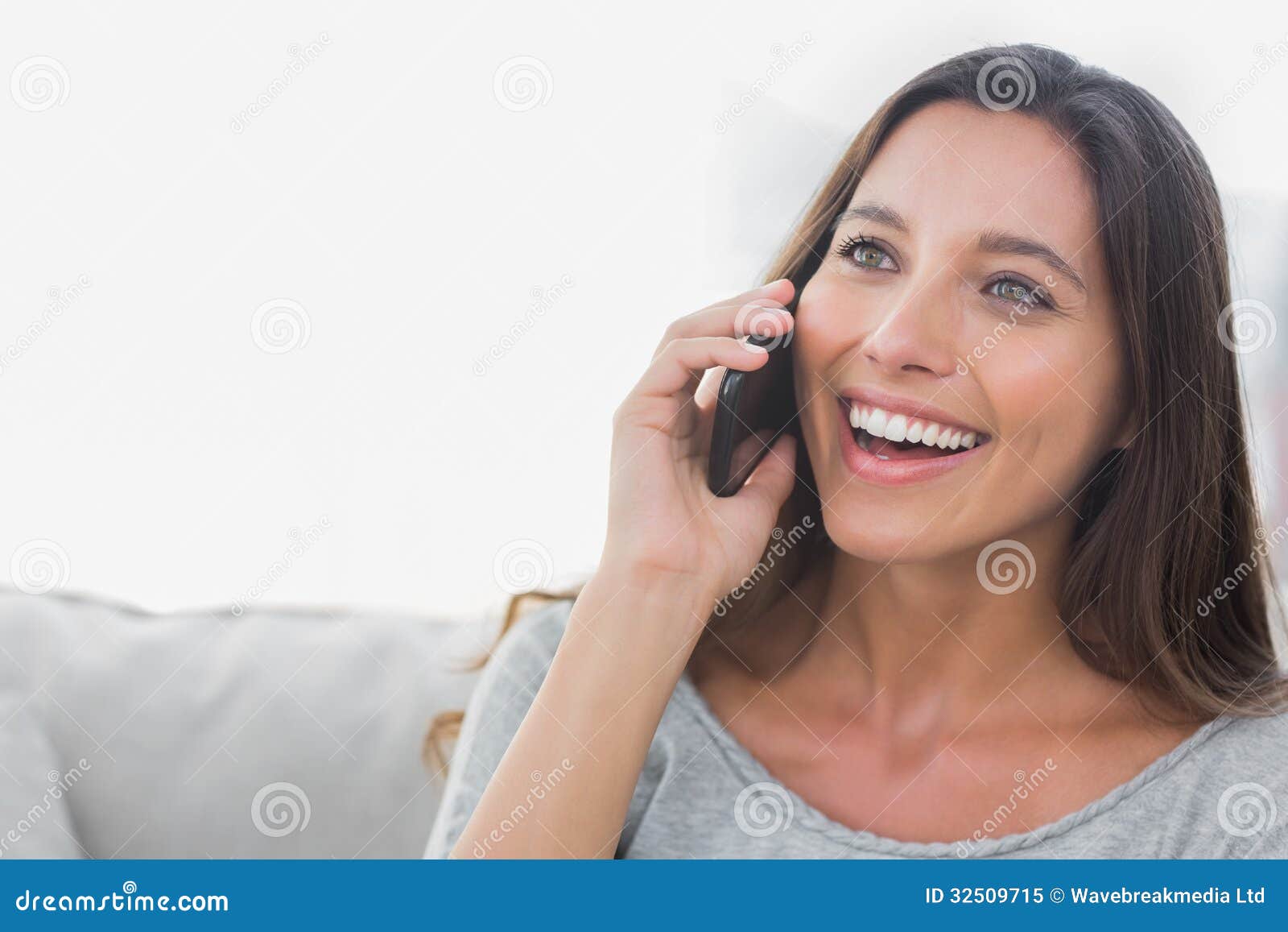 Woman Laughing while she is on the Phone Stock Image - Image of ...
