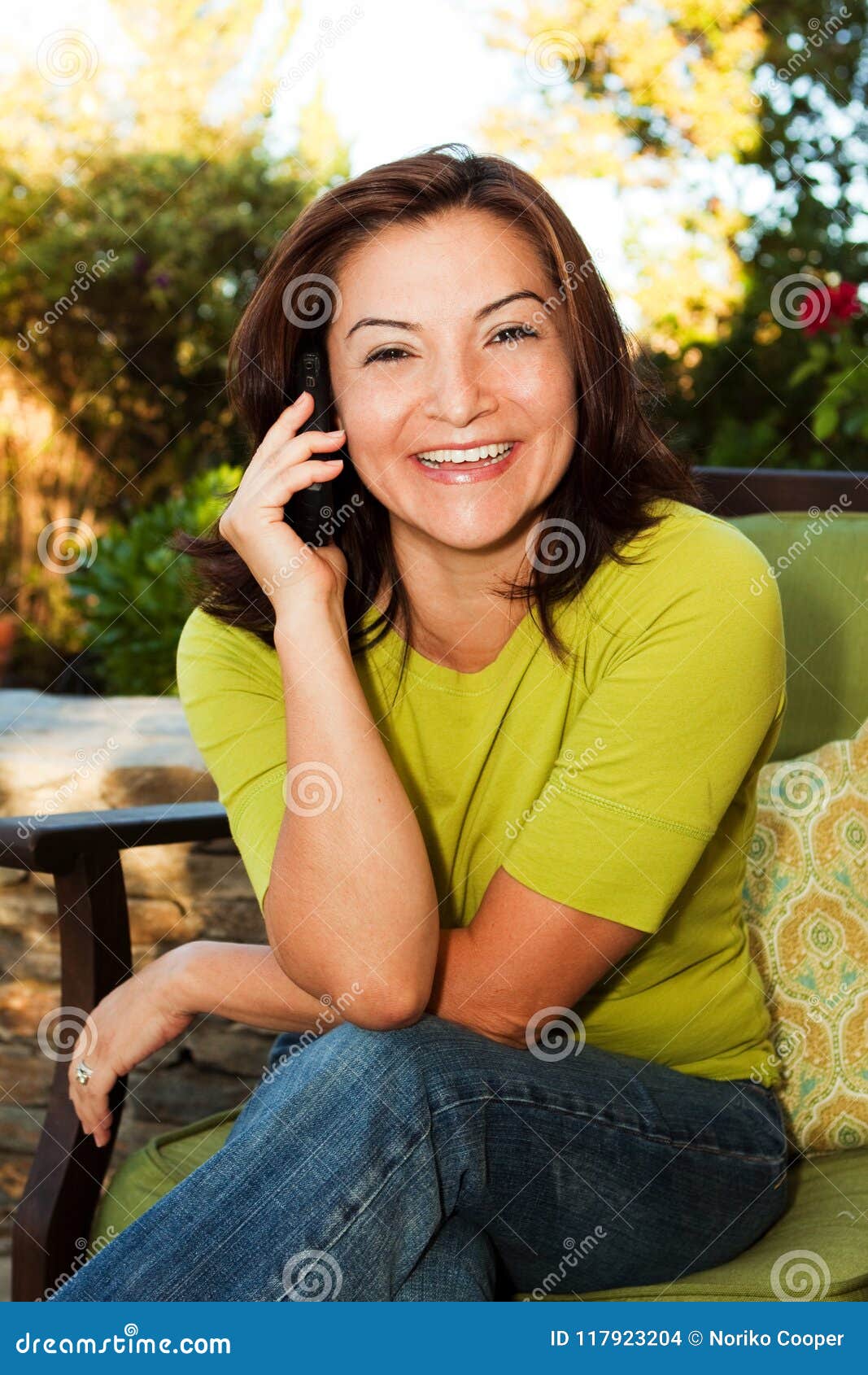 Hispanic Woman Smiling Talking on the Phone. Stock Photo - Image of ...