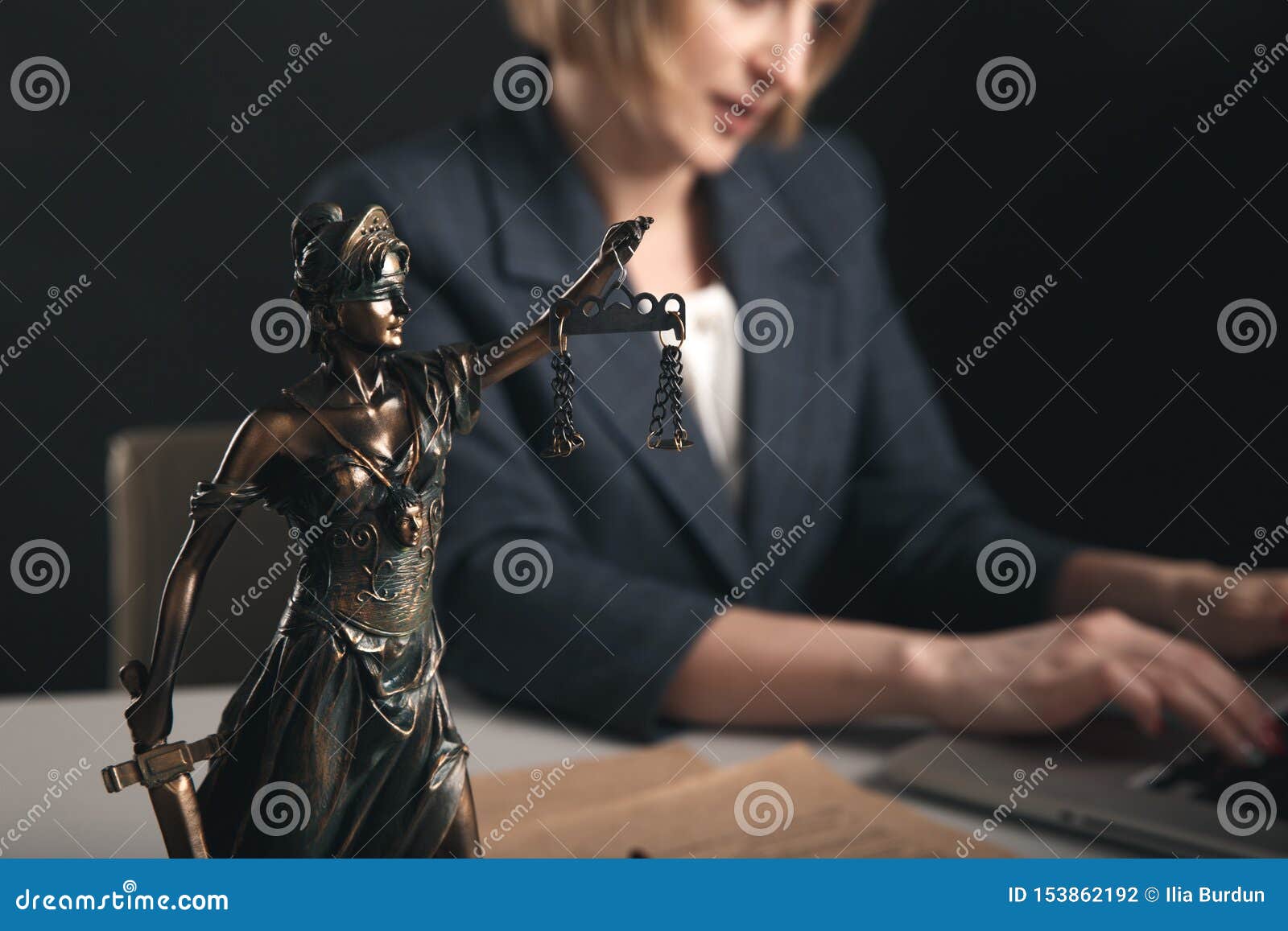 Woman Lawyer Working on a Computer Sitting at the Table in Office ...