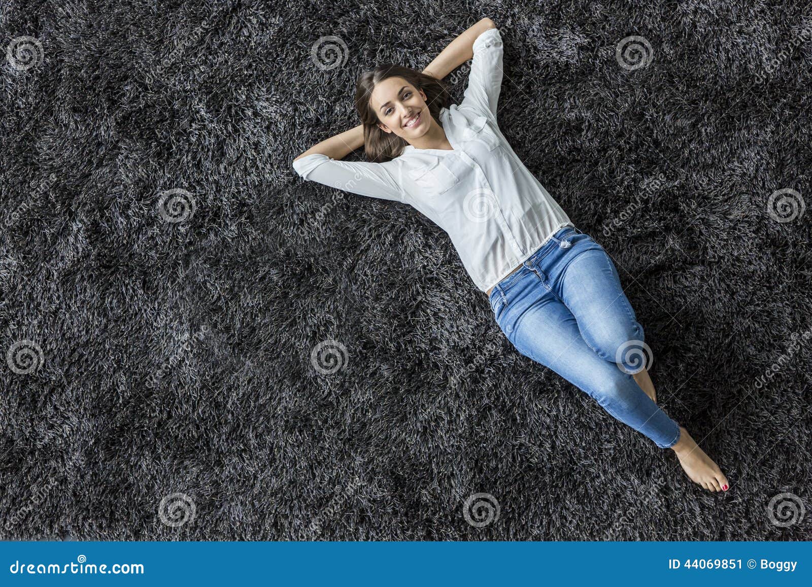 Woman laying on the carpet stock image. Image of upper - 44069851