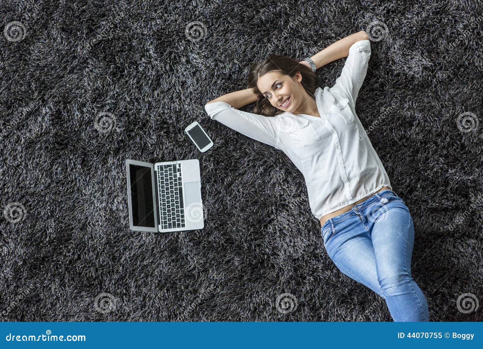 Woman laying on the carpet stock image. Image of back - 44070755