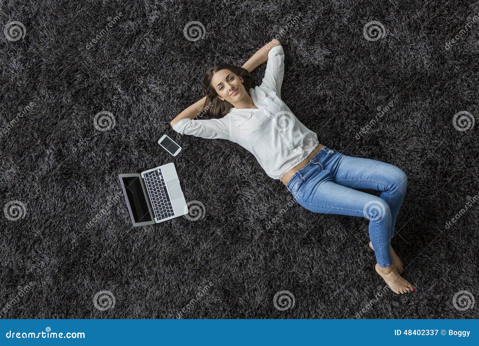 Woman laying on the carpet stock image. Image of pretty - 48402337