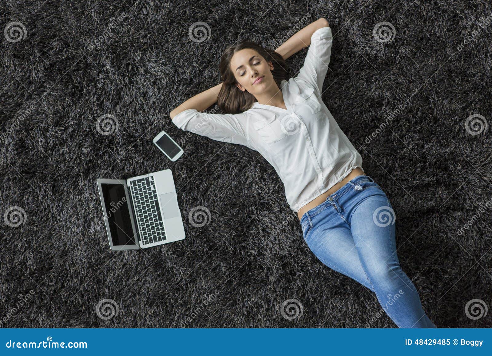 Woman laying on the carpet stock image. Image of floor - 48429485