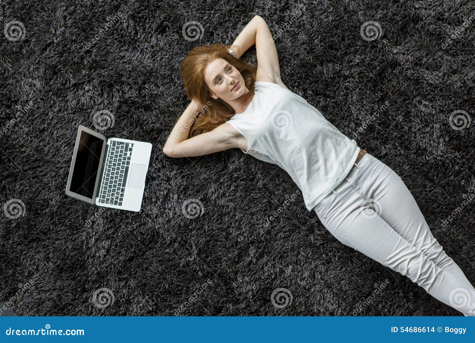 Woman laying on the carpet stock photo. Image of girl - 54686614