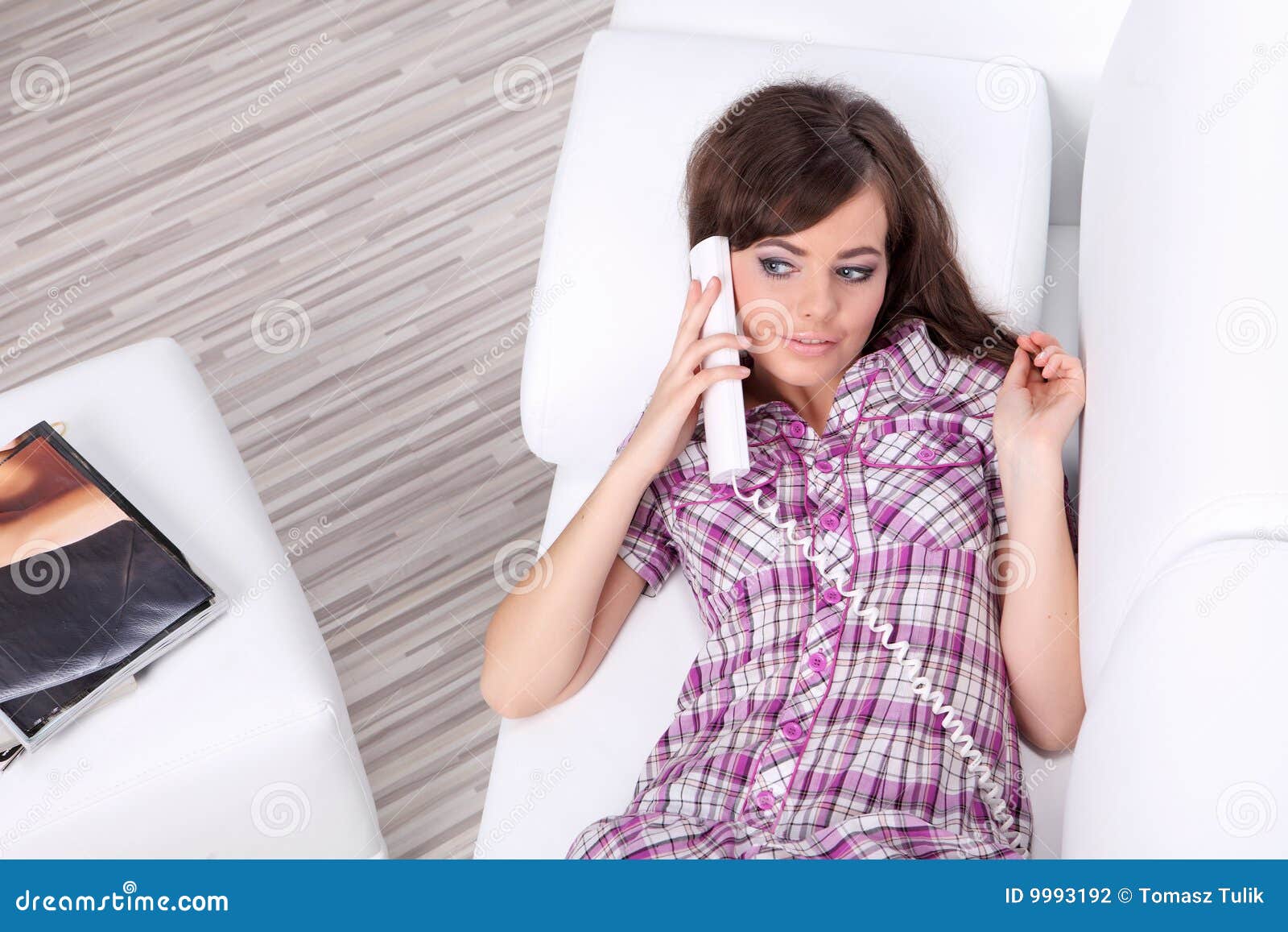 Woman Laying on Couch Talking on Telephone Stock Photo - Image of ...