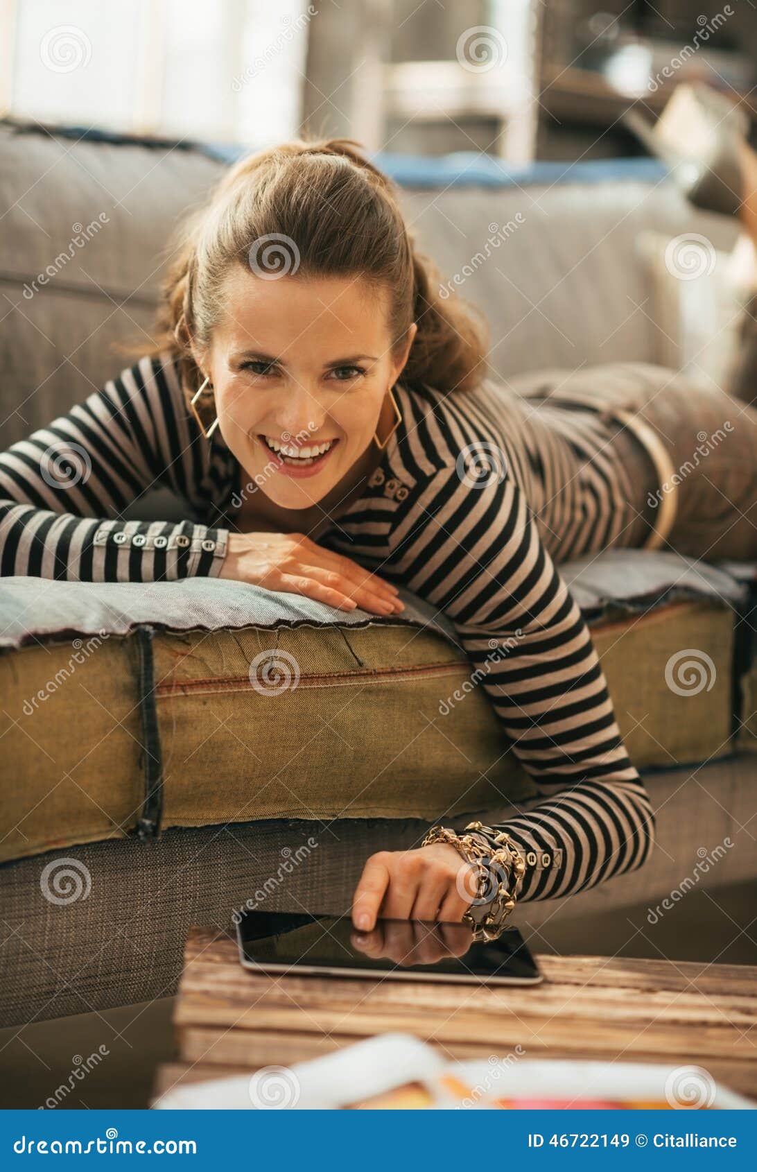 Woman Laying on Couch and Using Tablet Pc Stock Image - Image of loft ... Woman Laying on Couch and Using Tablet Pc Stock Image - Image of loft ...