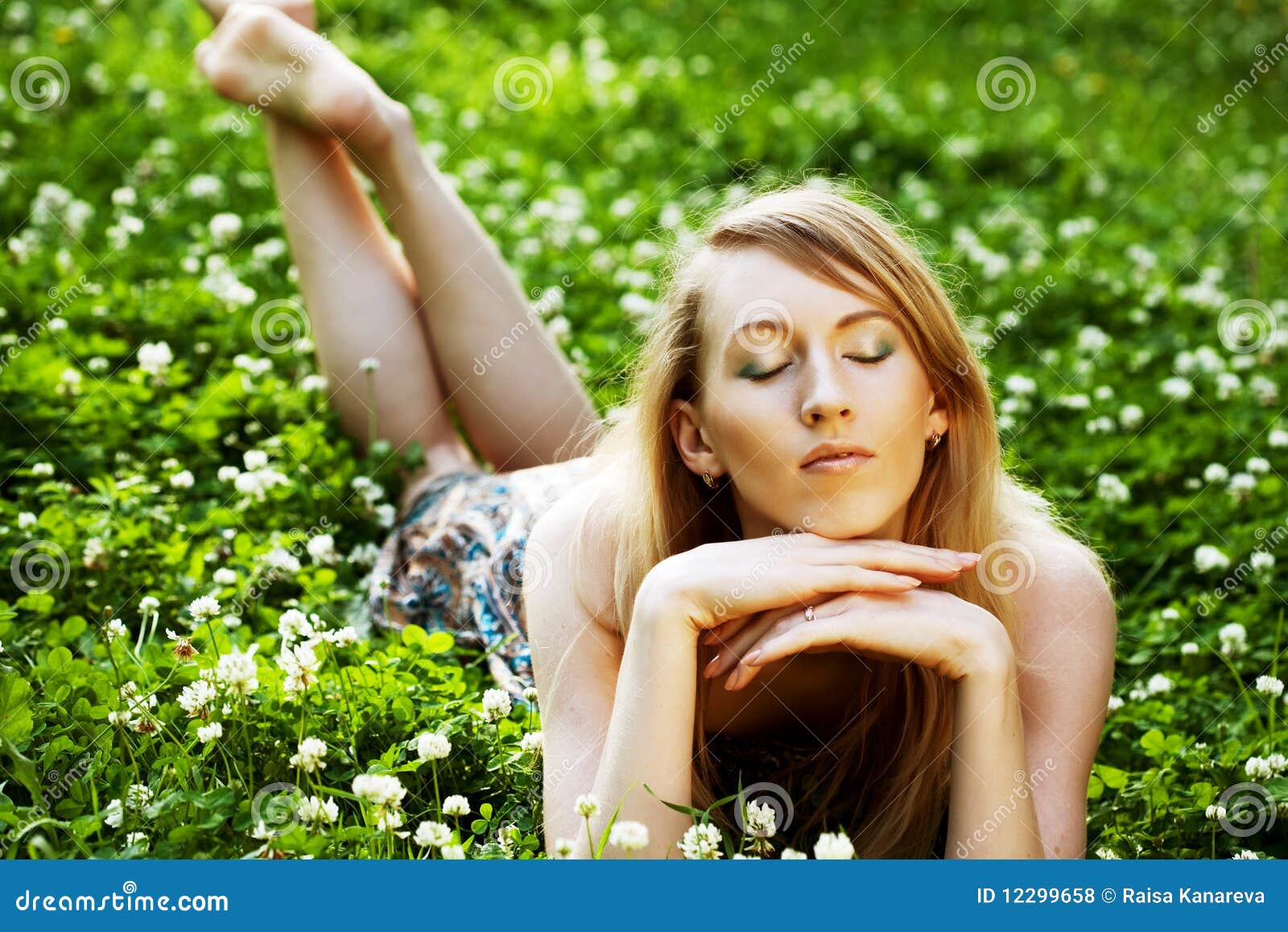 Woman laying on the grass stock photo. Image of happiness - 12299658