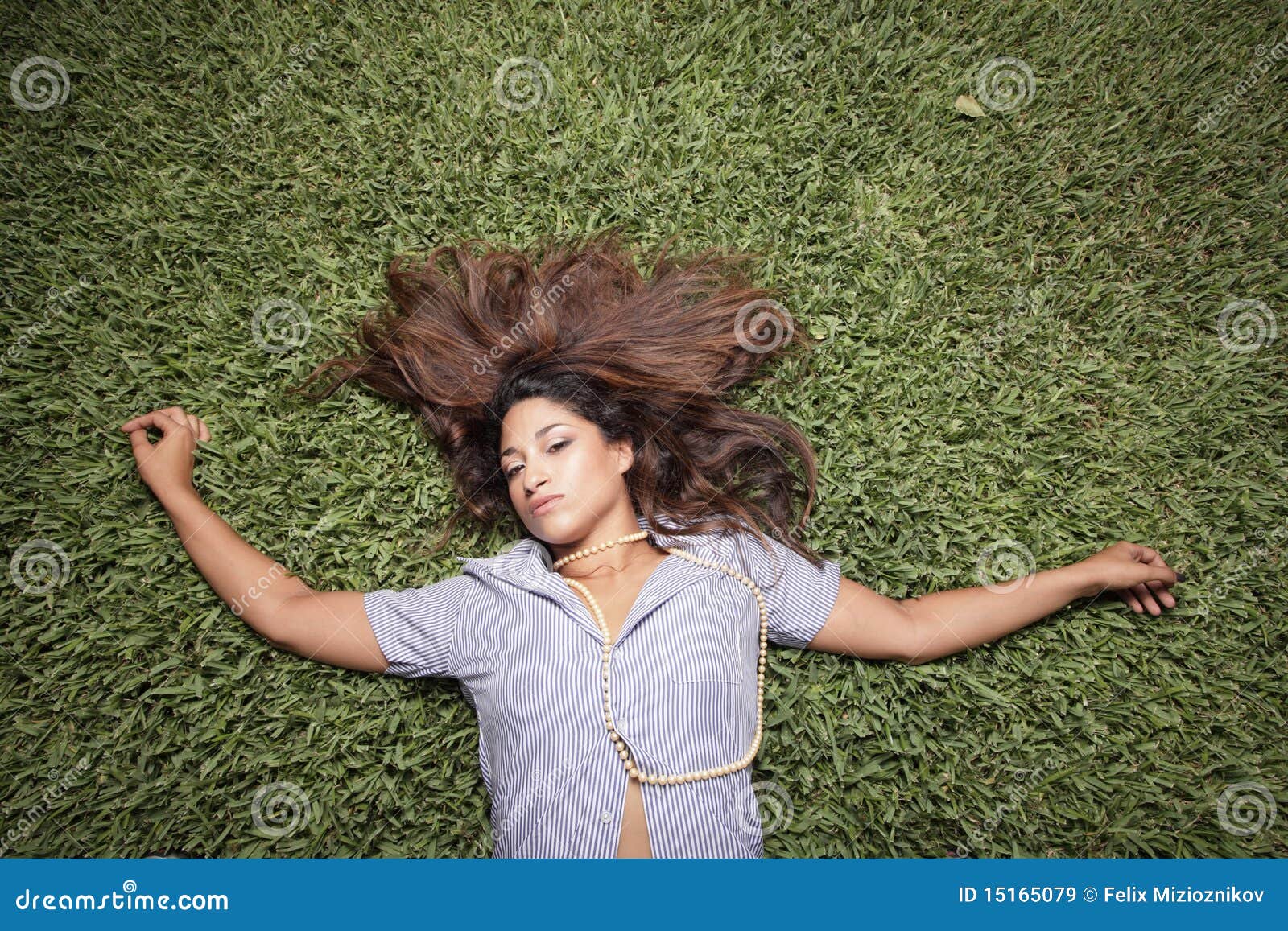 Woman laying on the grass stock image. Image of person - 15165079