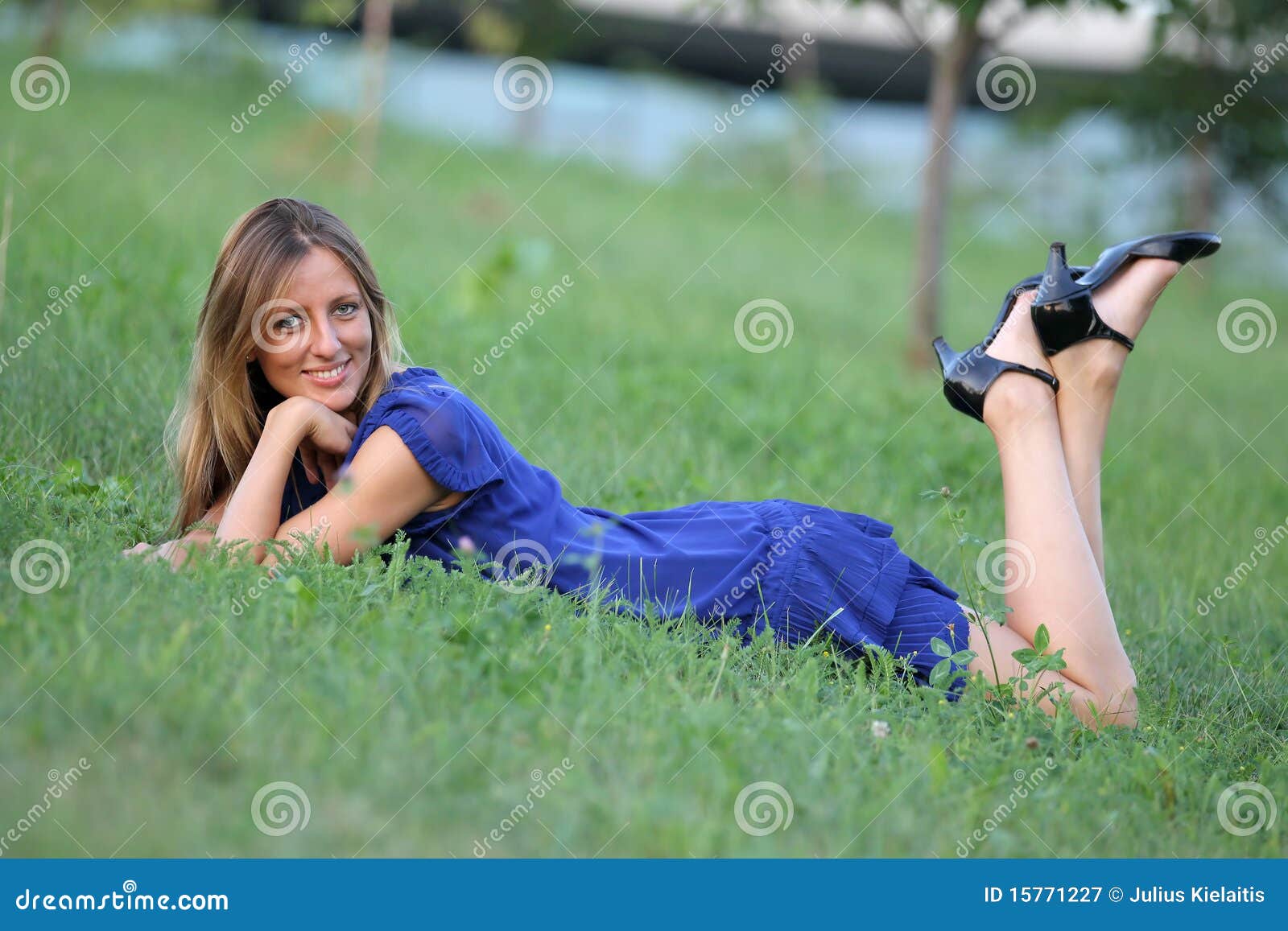 WOMAN LAYING on the GRASS stock image. Image of happy - 15771227