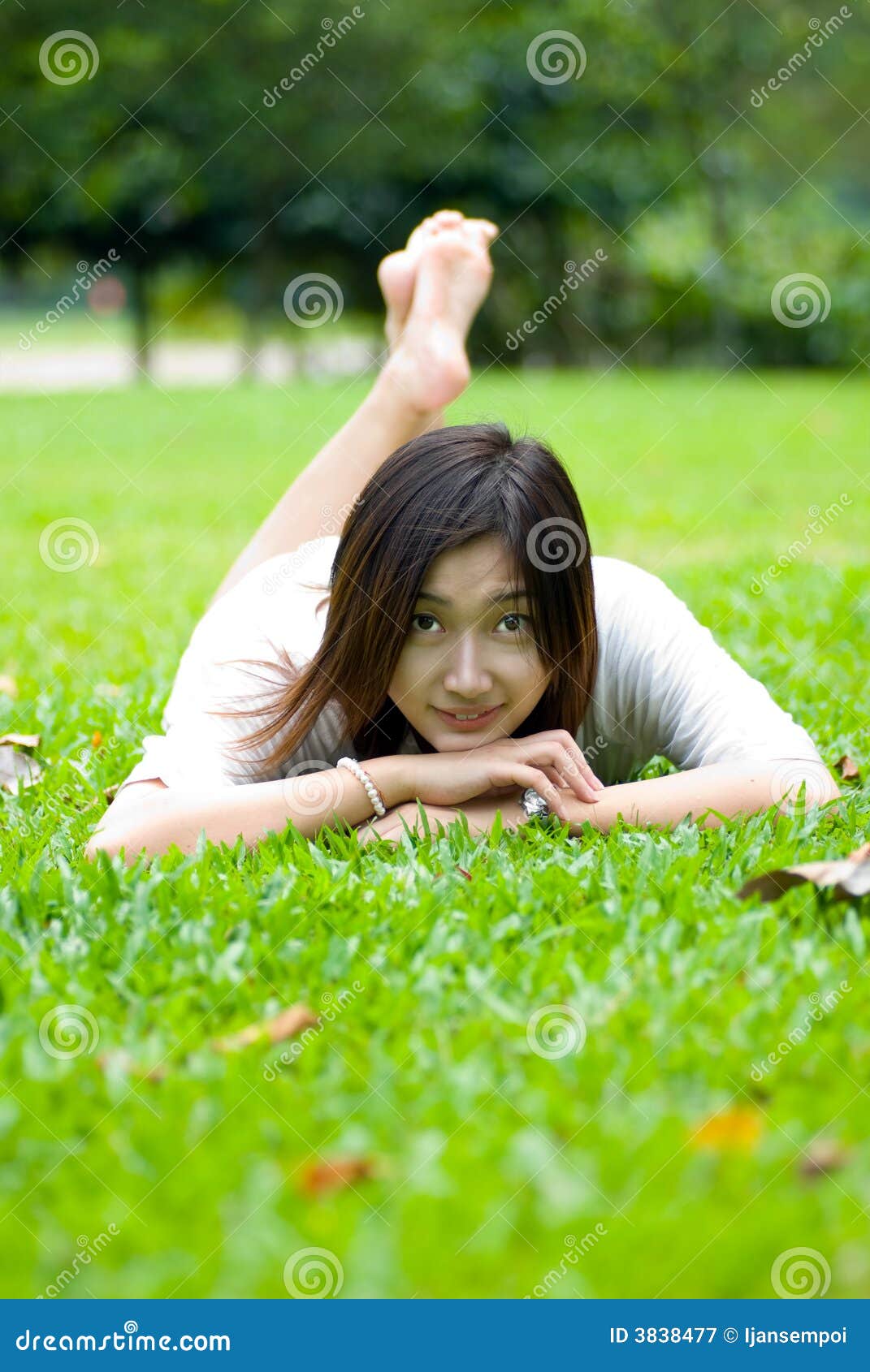 Woman laying on the grass stock image. Image of vacation - 3838477