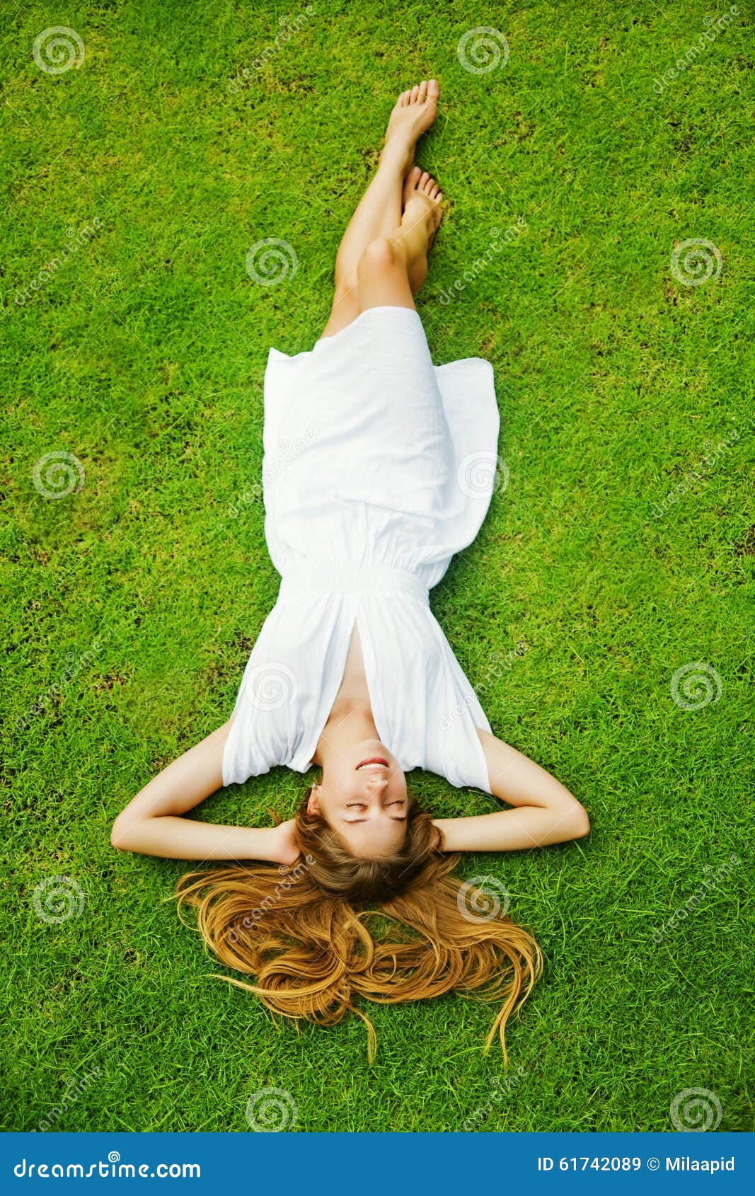 Woman laying on a grass stock image. Image of outdoor - 61742089