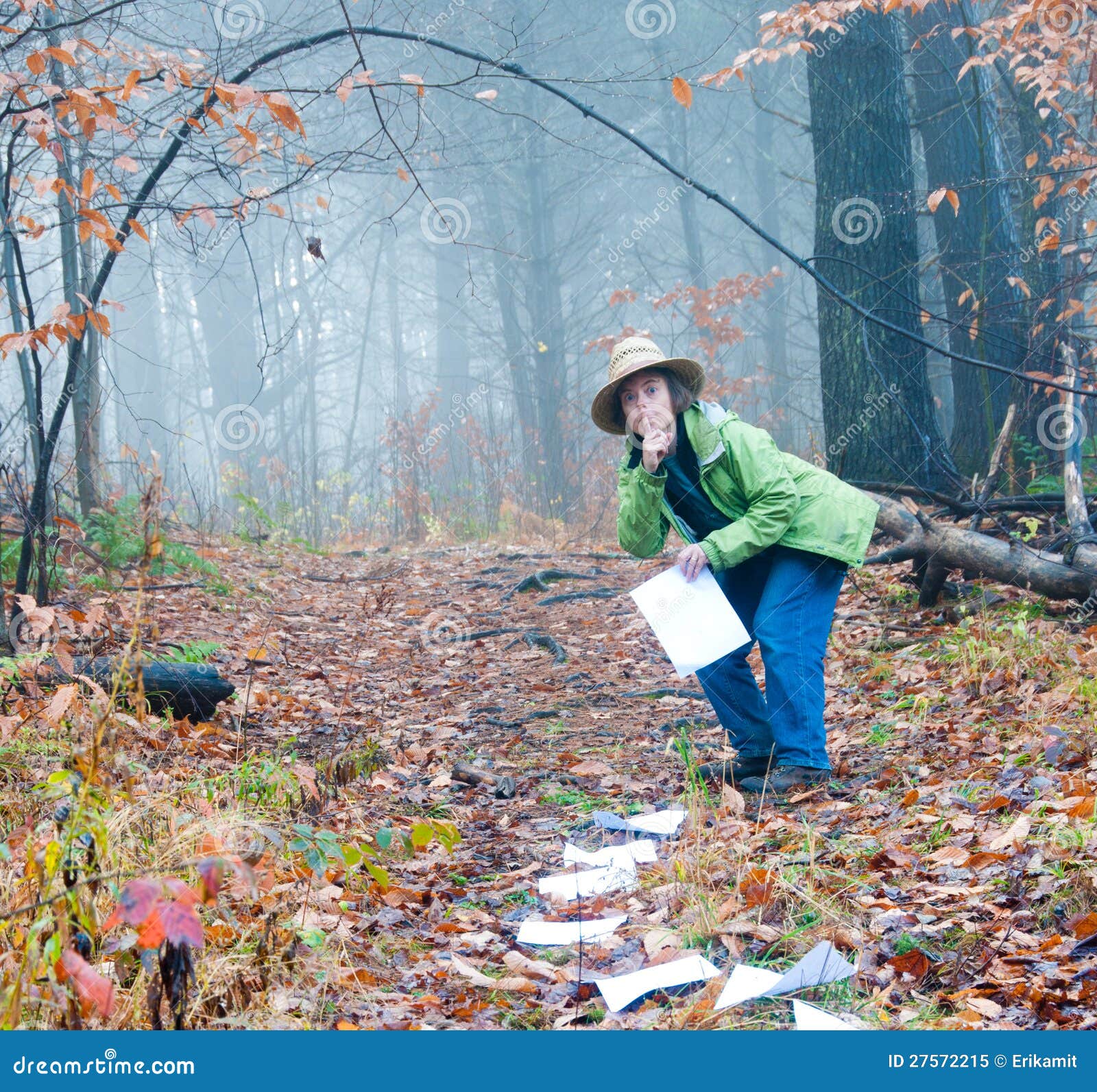 Woman laying a paper trail stock image. Image of woods - 27572215