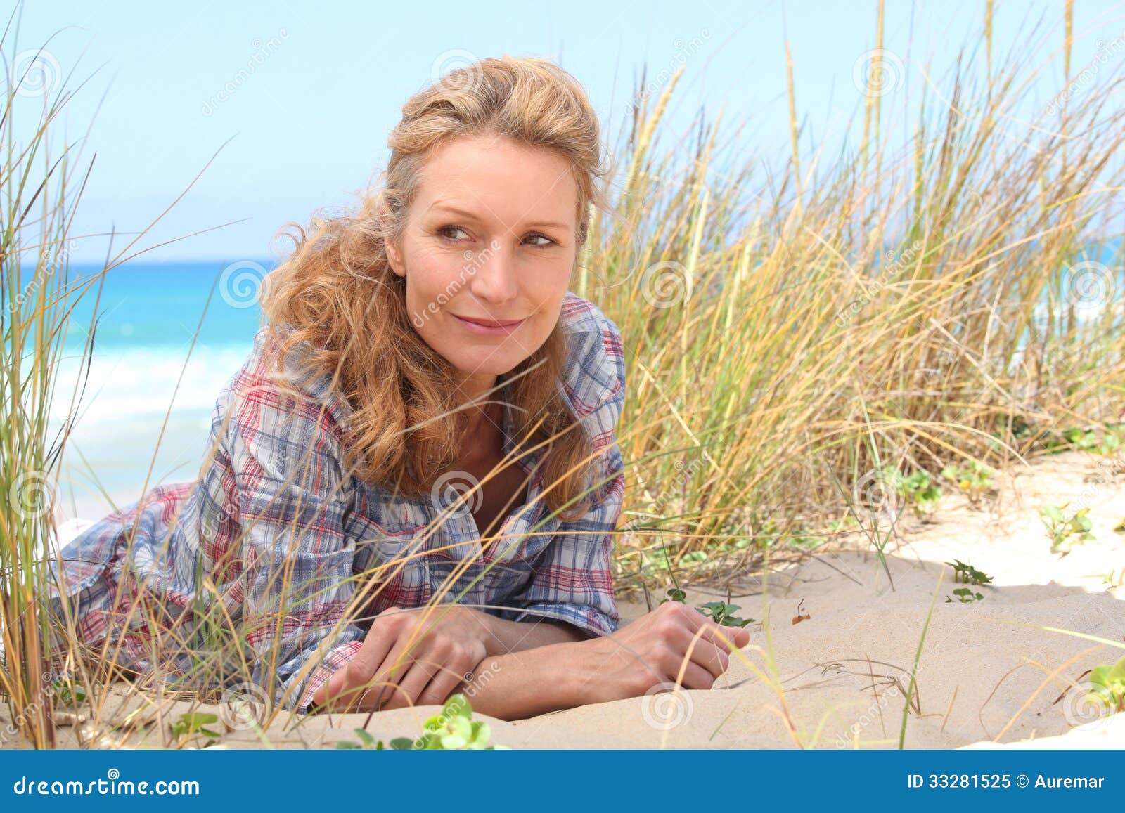 Woman laying on the sand stock image. Image of relaxing - 33281525