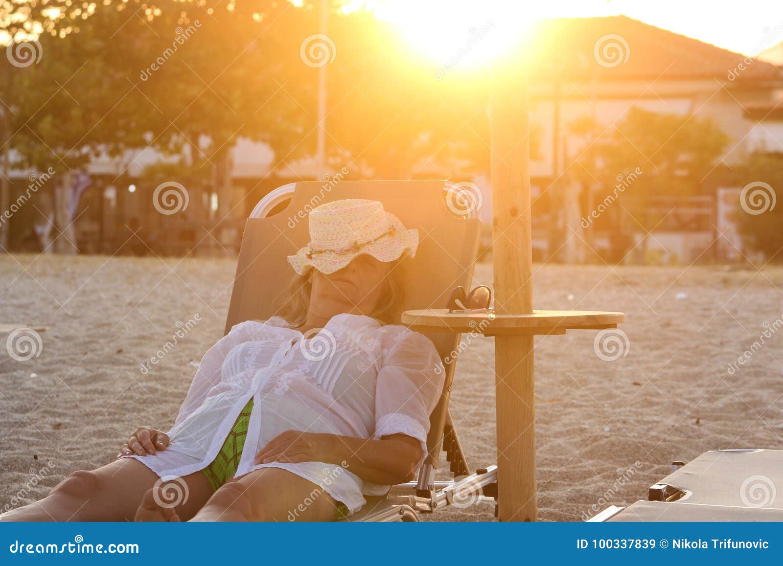 Woman Laying on the Sunbed and Sleeping on the Beach Stock Image ...