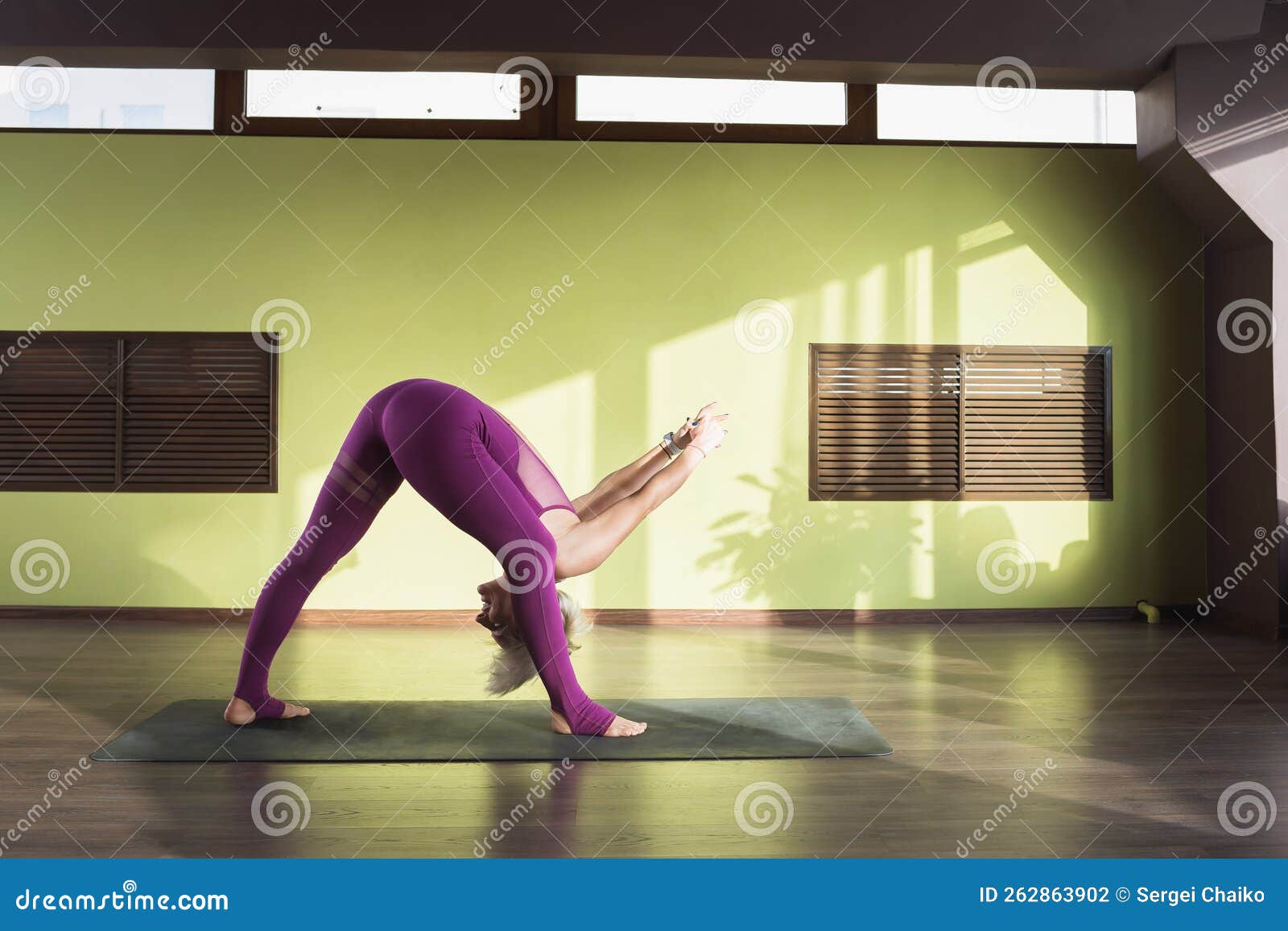 A Woman Leading A Healthy Lifestyle And Practicing Yoga Performs The Exercise Prasarita